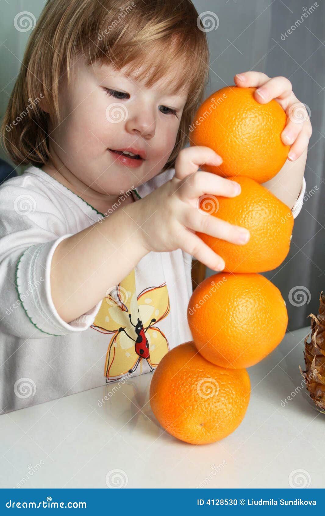Girl and 4 oranges stock photo. Image of fresh, compare - 4128530