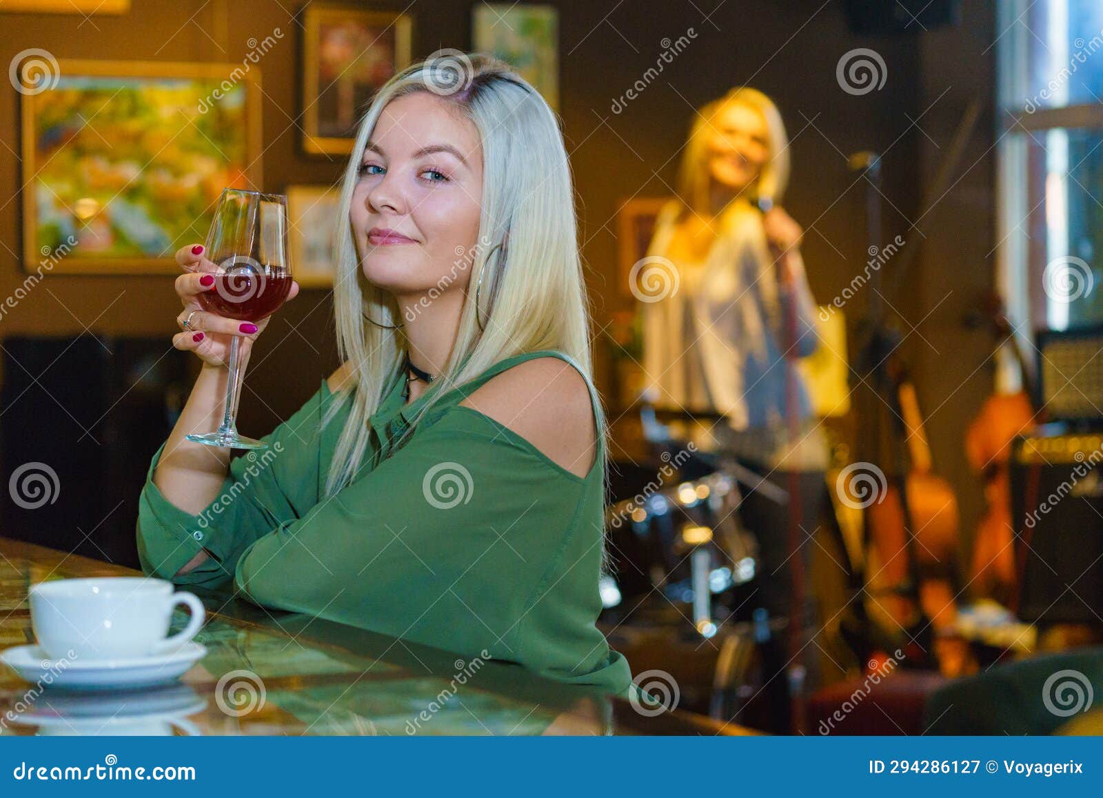 Alcohol In The Glass. Ice Cube Falls Into A Glass With Splashes ... Alcohol In The Glass. Ice Cube Falls Into A Glass With Splashes ...