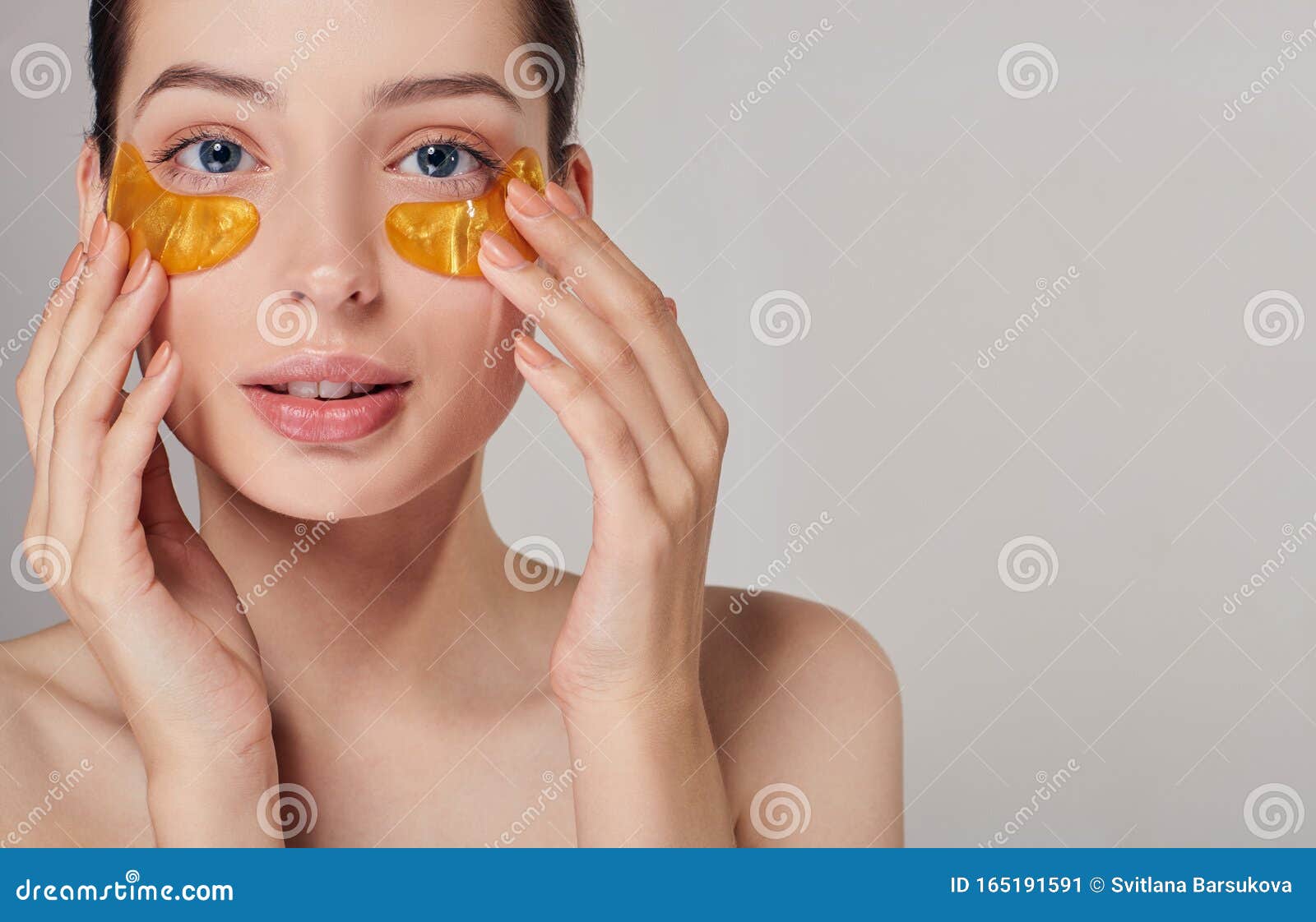 Girl Applying Golden Collagen Patches Under The Eyes Remove Wrinkles