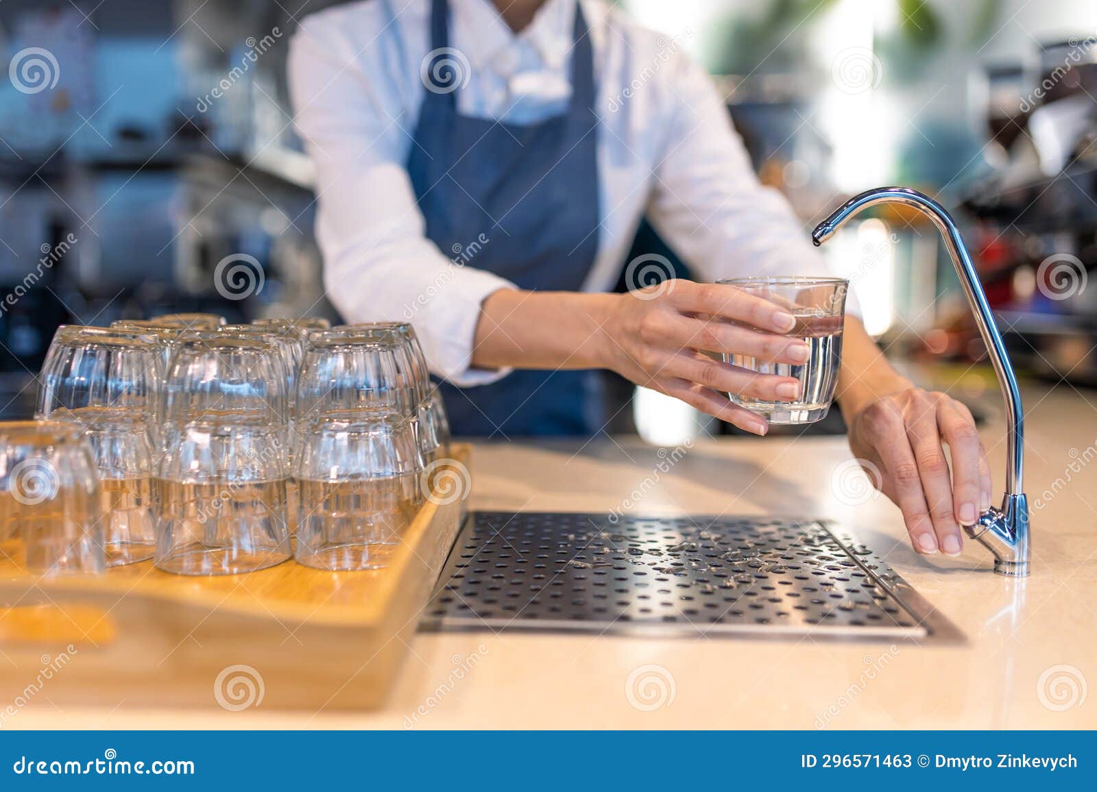 Girl in Apron Cleaning a Cup and Looking Contented Stock Image - Image ...