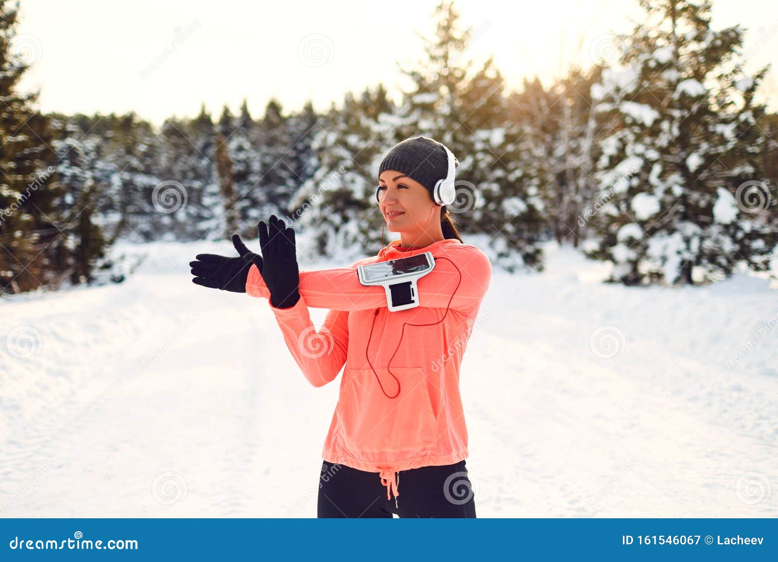 Girl Athlete Does Stretching in the Snow in the Winter. Stock Image ...