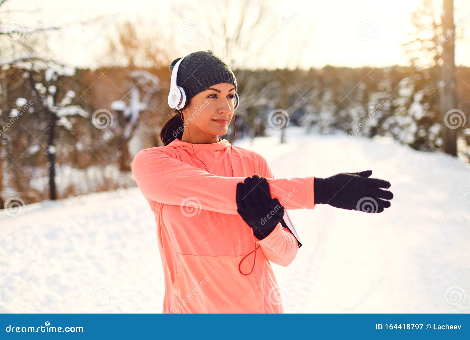 Girl Athlete Does Stretching in the Snow in the Winter. Stock Image ...