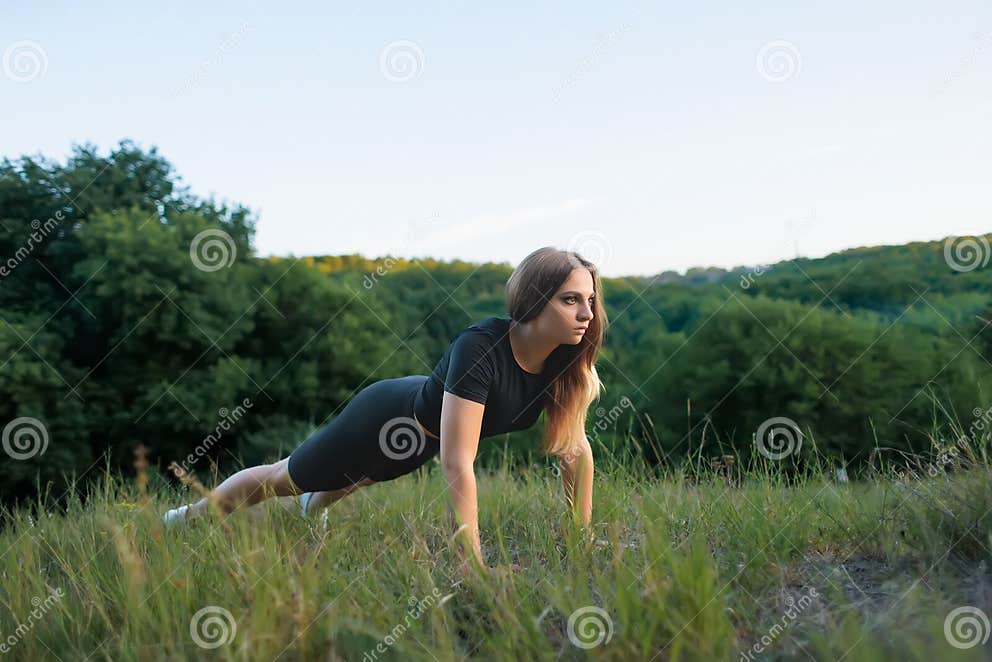 Girl Athlete Performs Push-ups in the Park Stock Photo - Image of ...