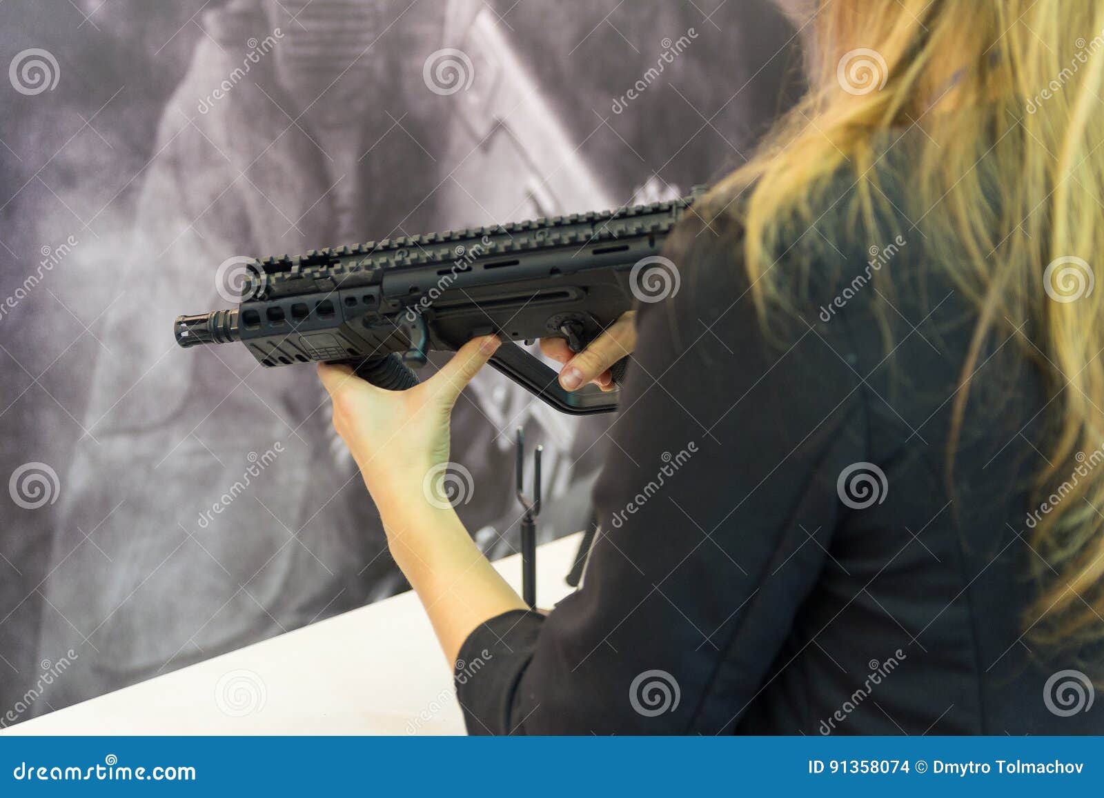 Girl with an Automatic Rifle in the Hands of the Counter. Weapon Stock ...