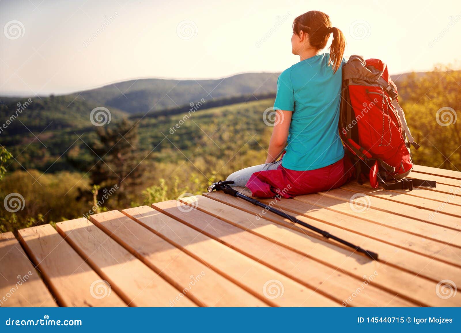 Girl with Backpack Sitting and Looking Nature, Back View Stock Image ...