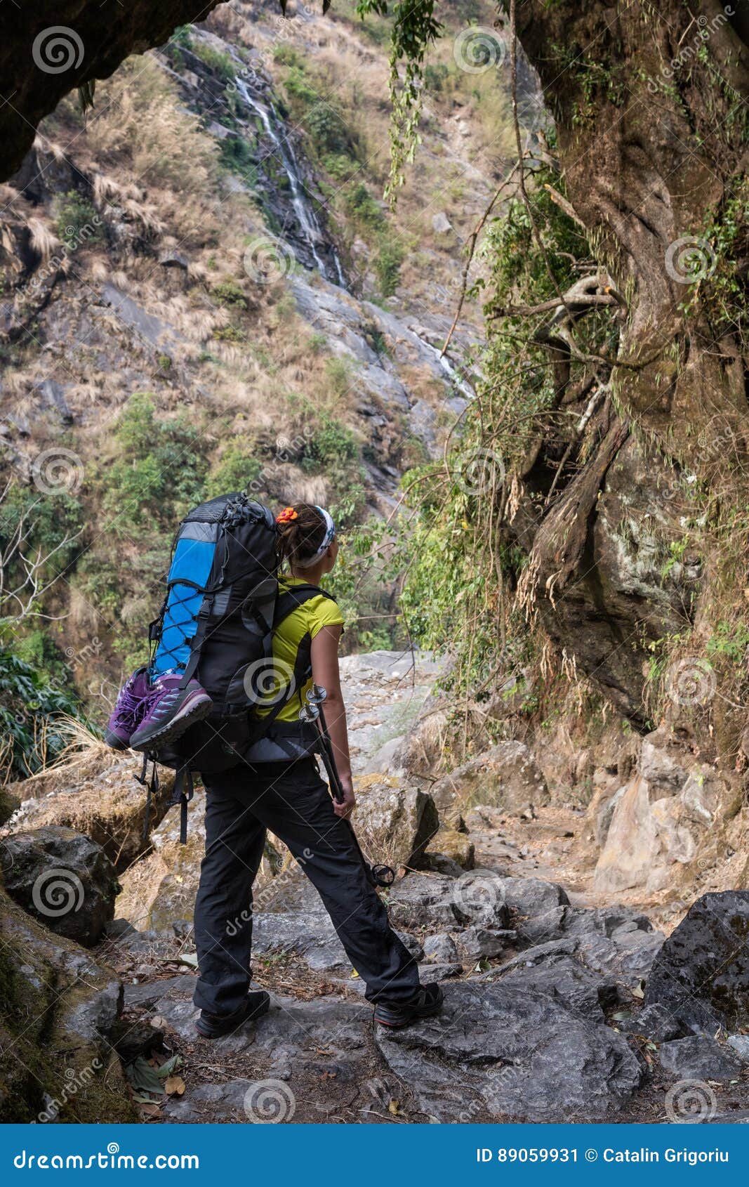 Girl with Backpack Watching a Waterfall Stock Image - Image of pause ...