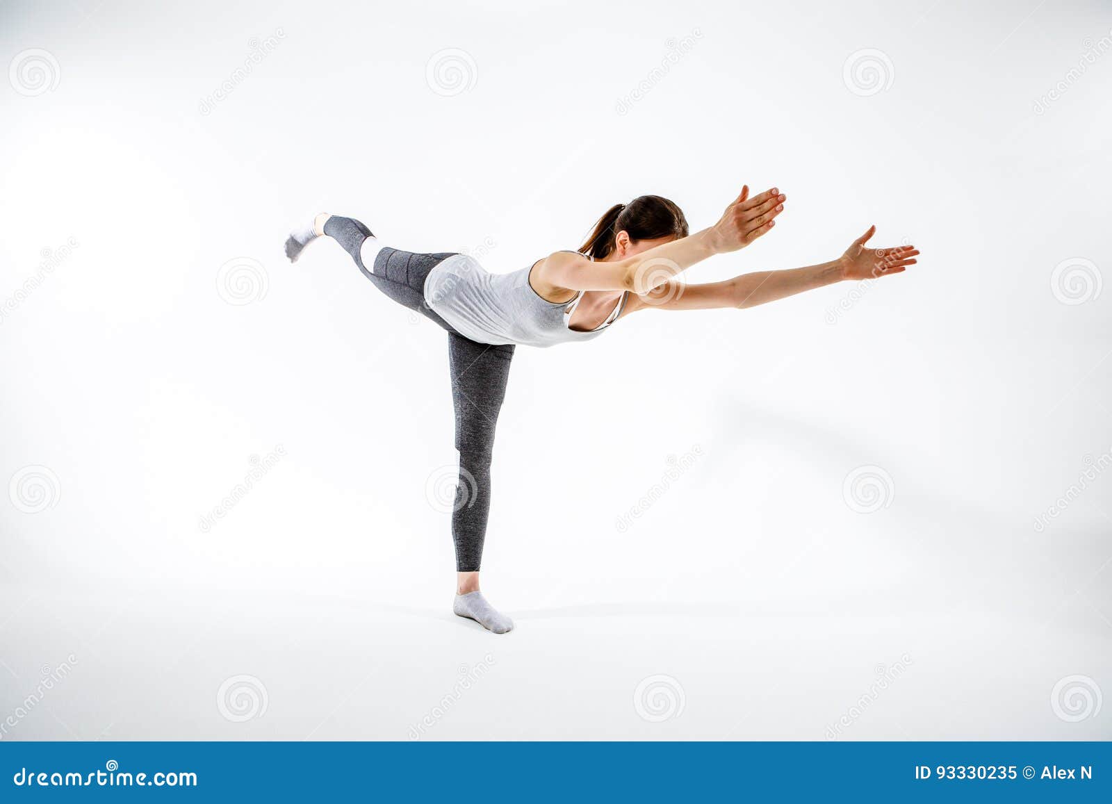 Girl balances on one leg stock image. Image of fitness - 93330235