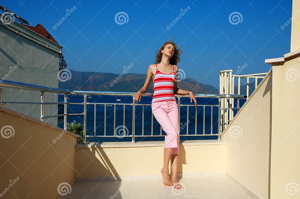 Girl on the balcony stock image. Image of tropical, female - 1036193
