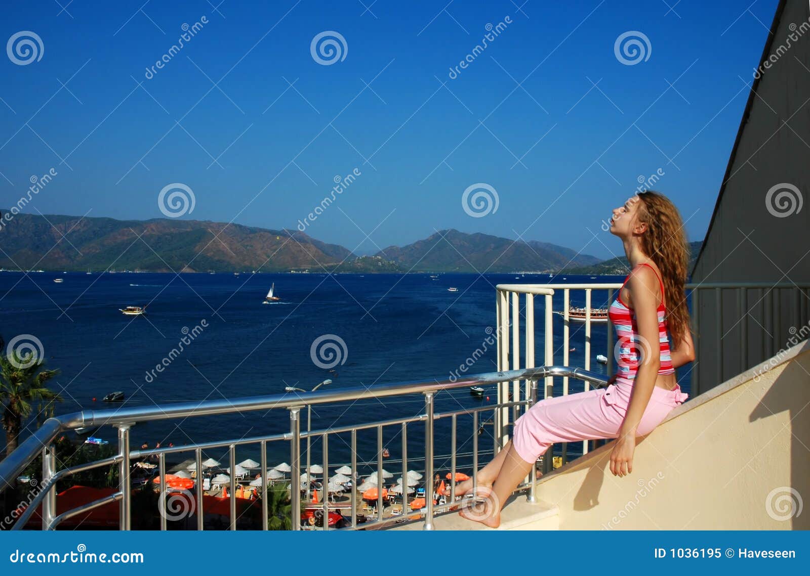 Girl on the balcony stock image. Image of tropics, travel - 1036195