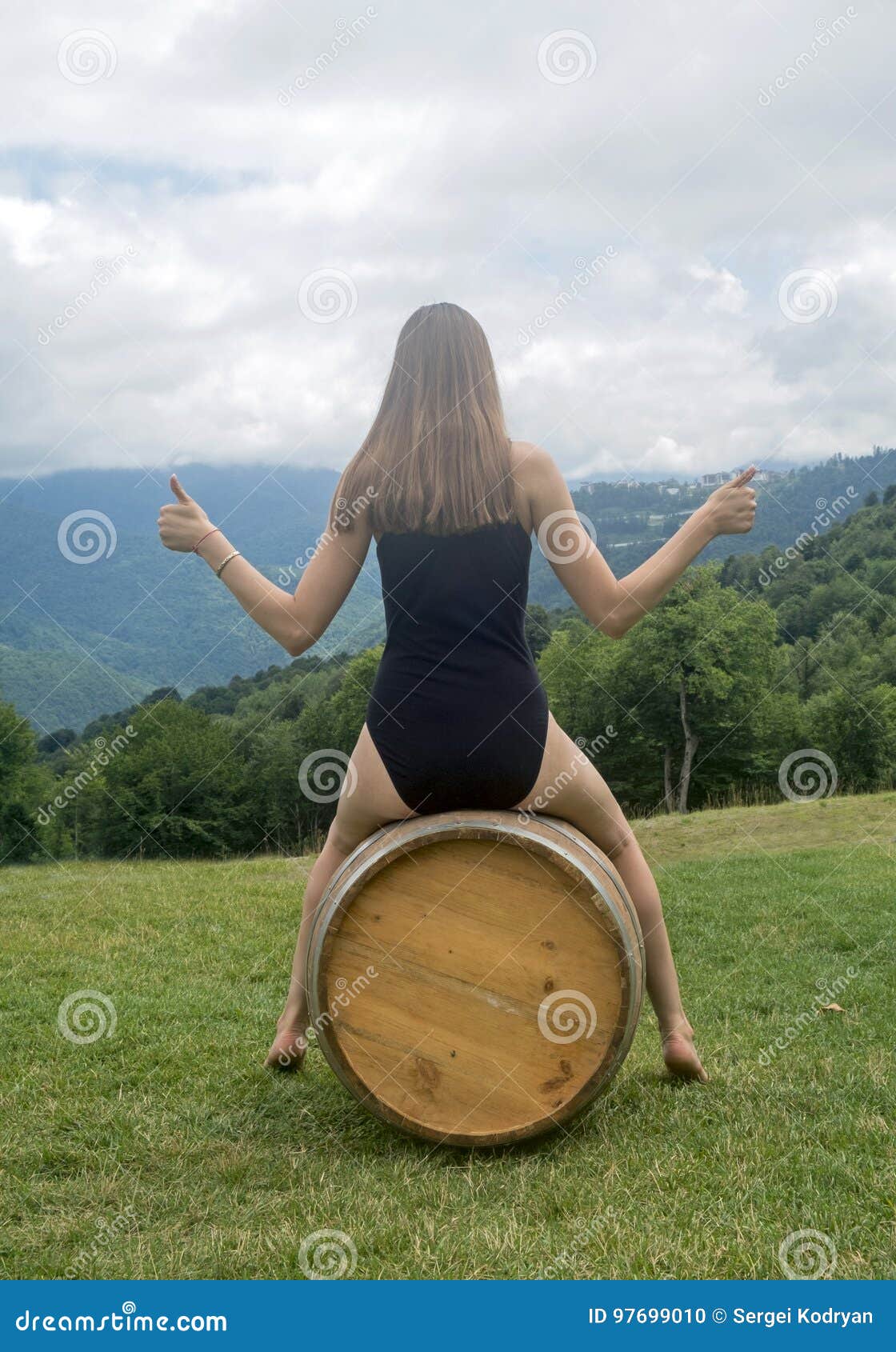 A girl on a barrel 2 stock photo. Image of nature, figure - 97699010