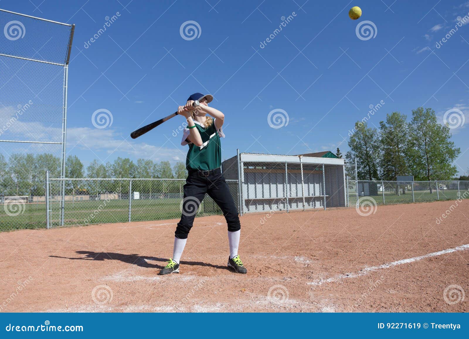 Girl batting a ball stock image. Image of ball, season - 92271619