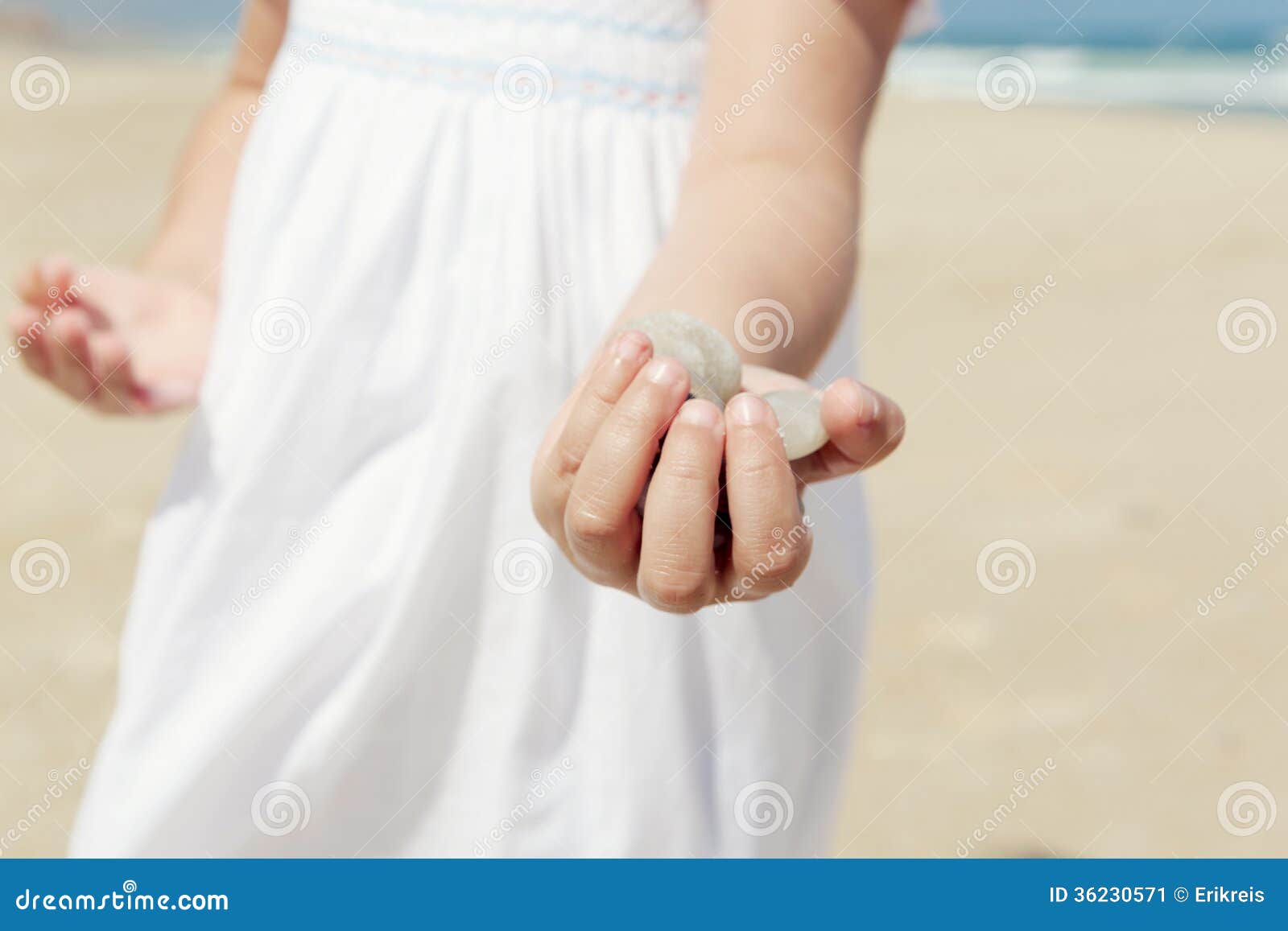 Girl on the Beach Holding Stones Stock Image - Image of seaside, pretty ...