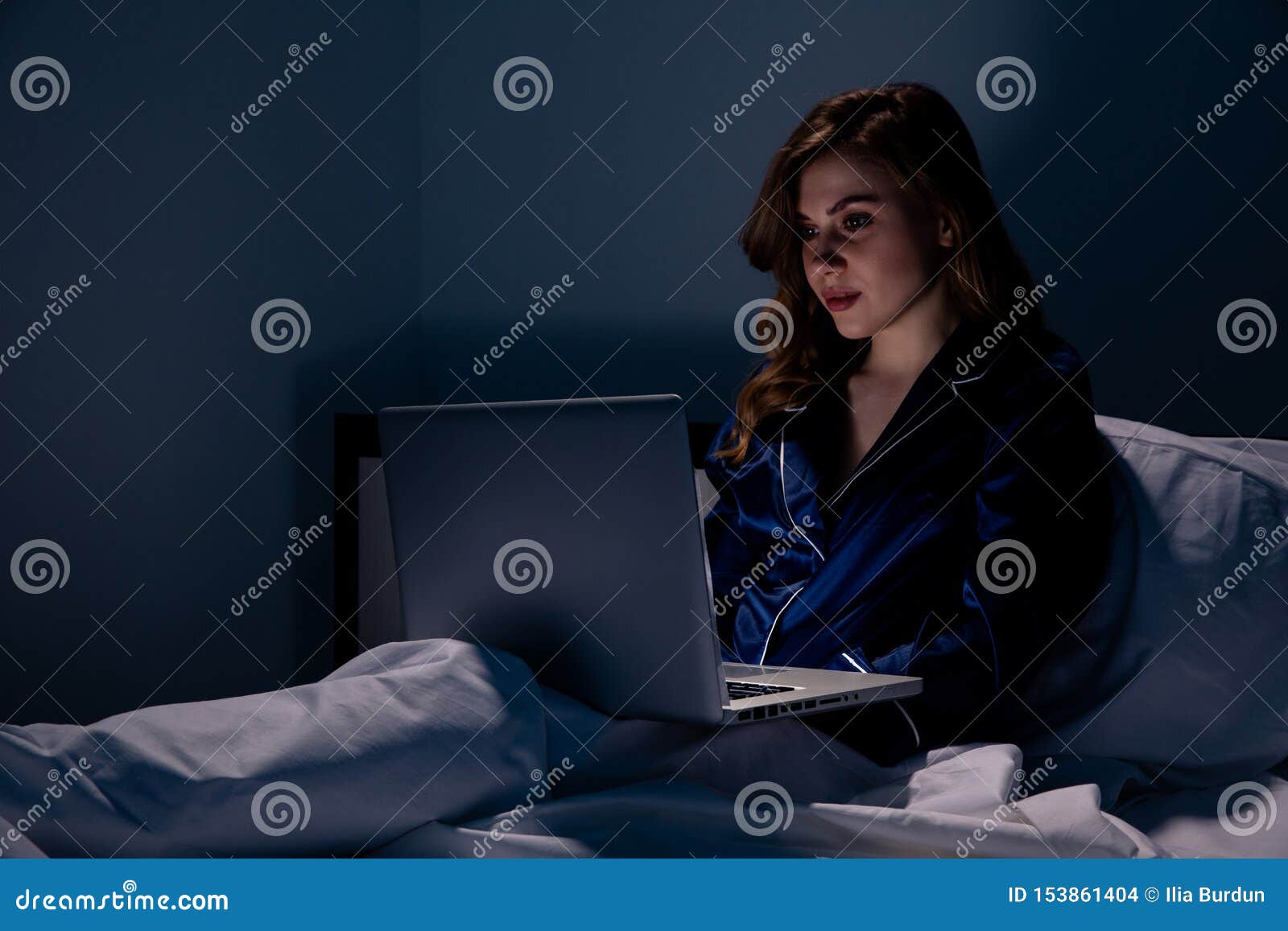 Girl in the Bed at Night Working on the Computer. Stock Photo - Image ...