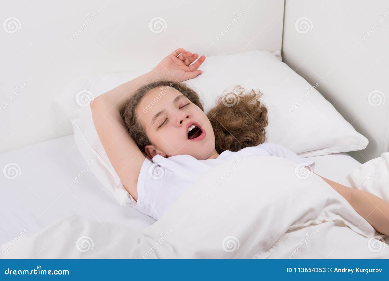 Girl in Bed Pulling Her Arms To Wake Up Stock Image - Image of closed ...