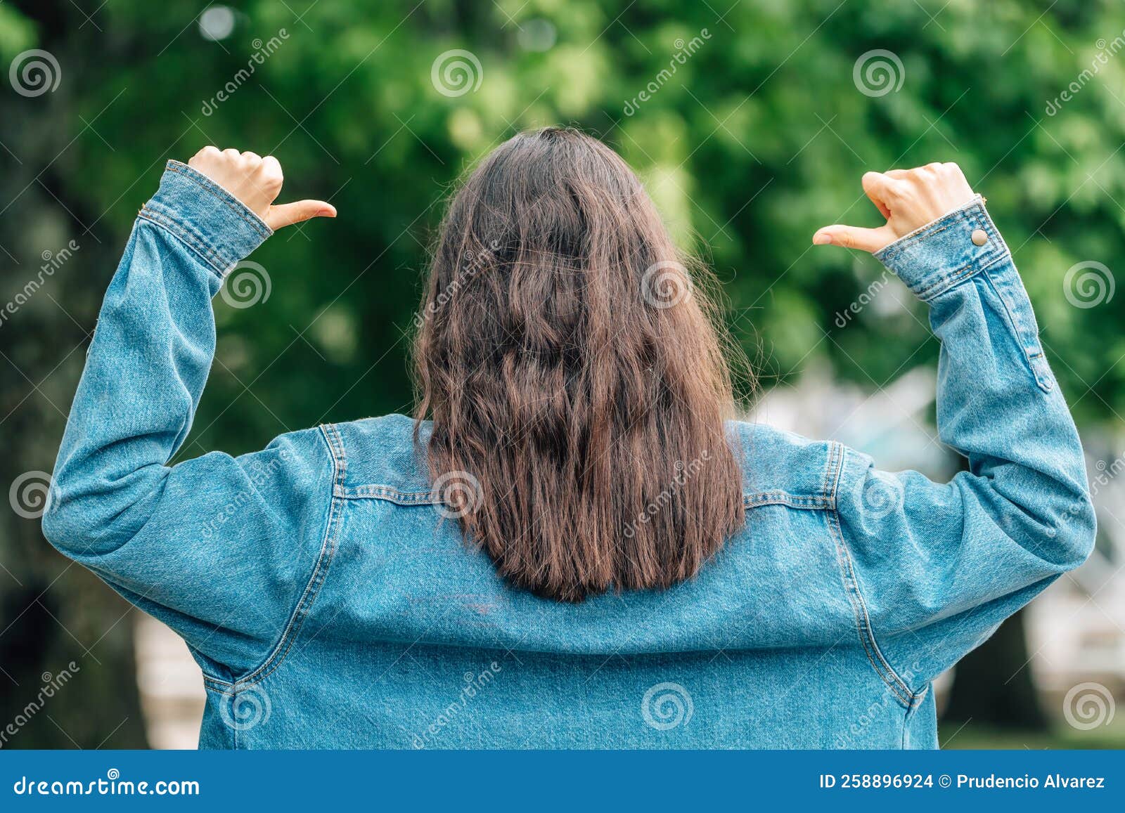 Girl from behind with okay stock photo. Image of satisfied - 258896924