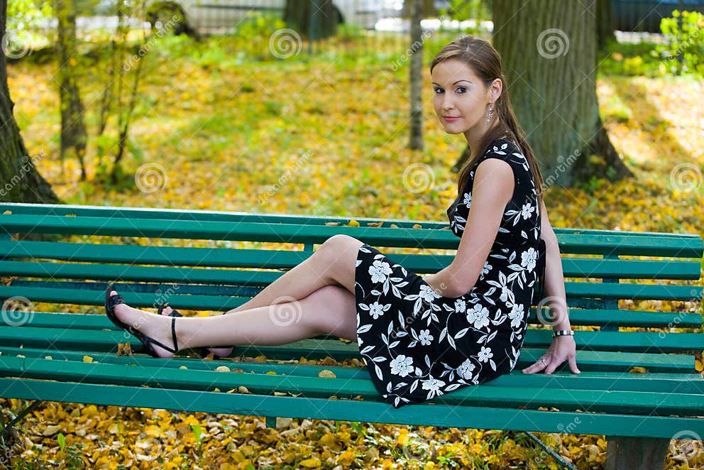 Girl on bench stock photo. Image of yellow, sunlight, beauty - 6857328