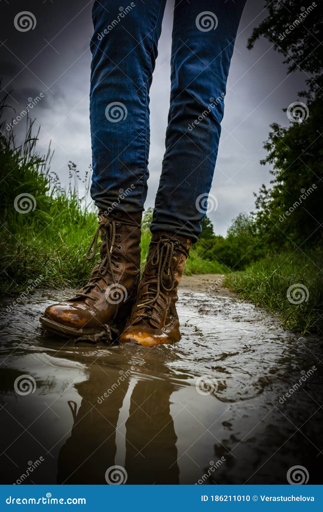 Boots is Walking in a Puddle Stock Photo - Image of closeup, boots ...