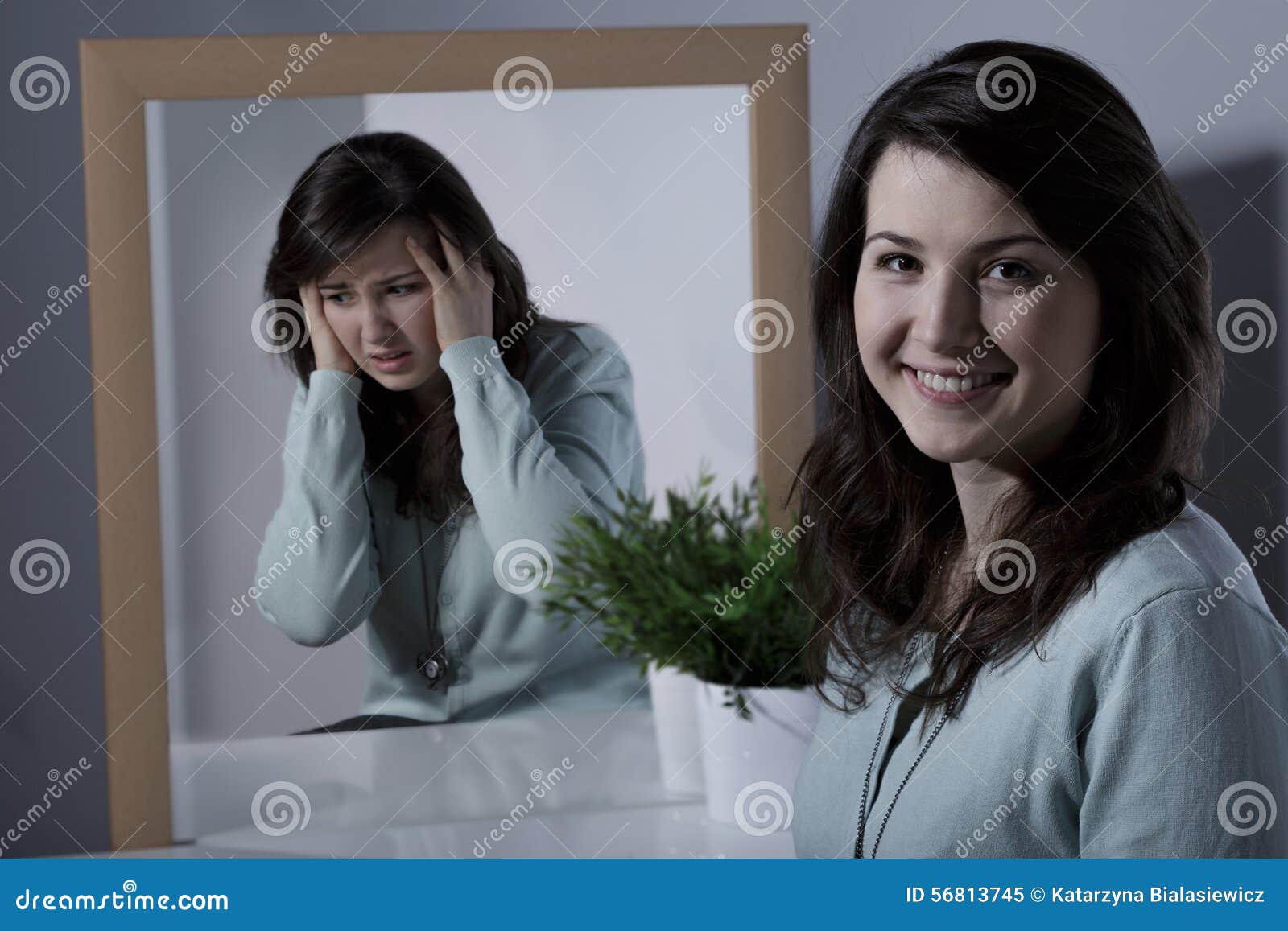 Bipolar Disorder. Young Girl Looking At Mirror Isolated On Light ...