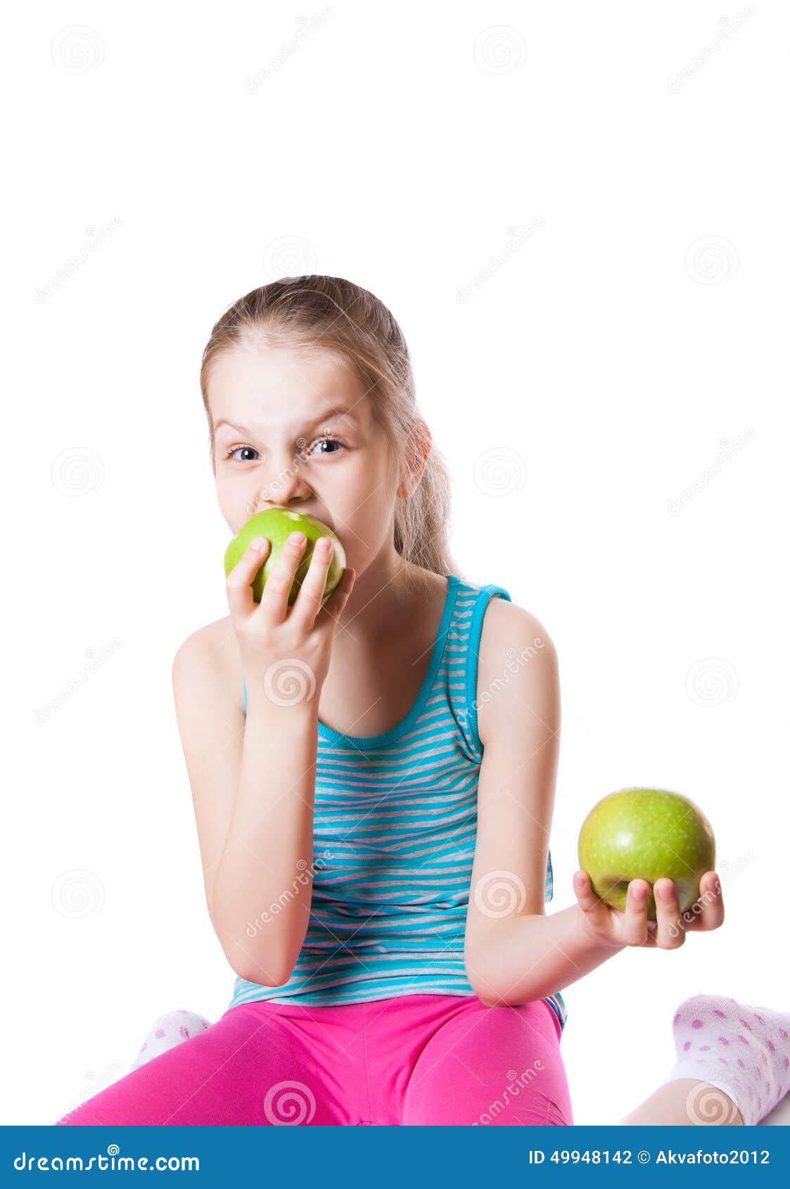 Girl biting an apple stock photo. Image of food, female - 49948142