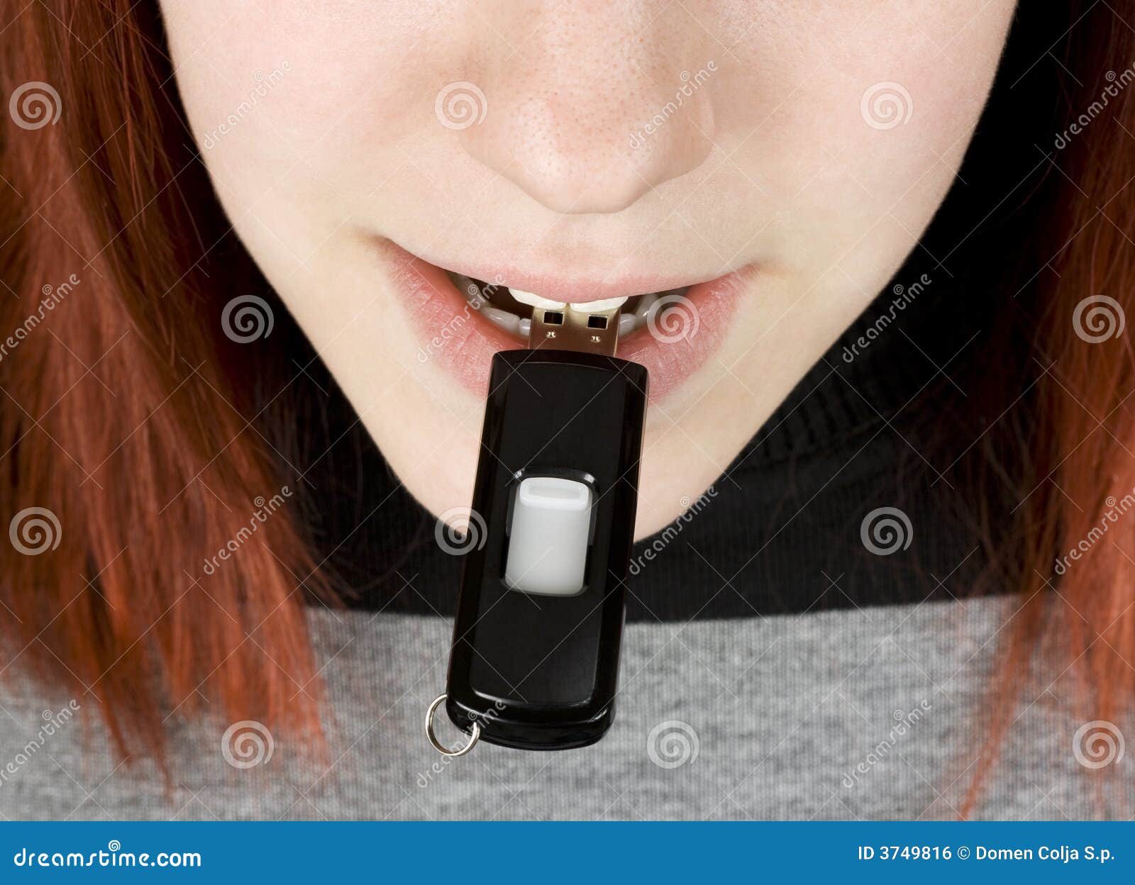 Girl Biting A Flash Drive Picture. Image: 3749816