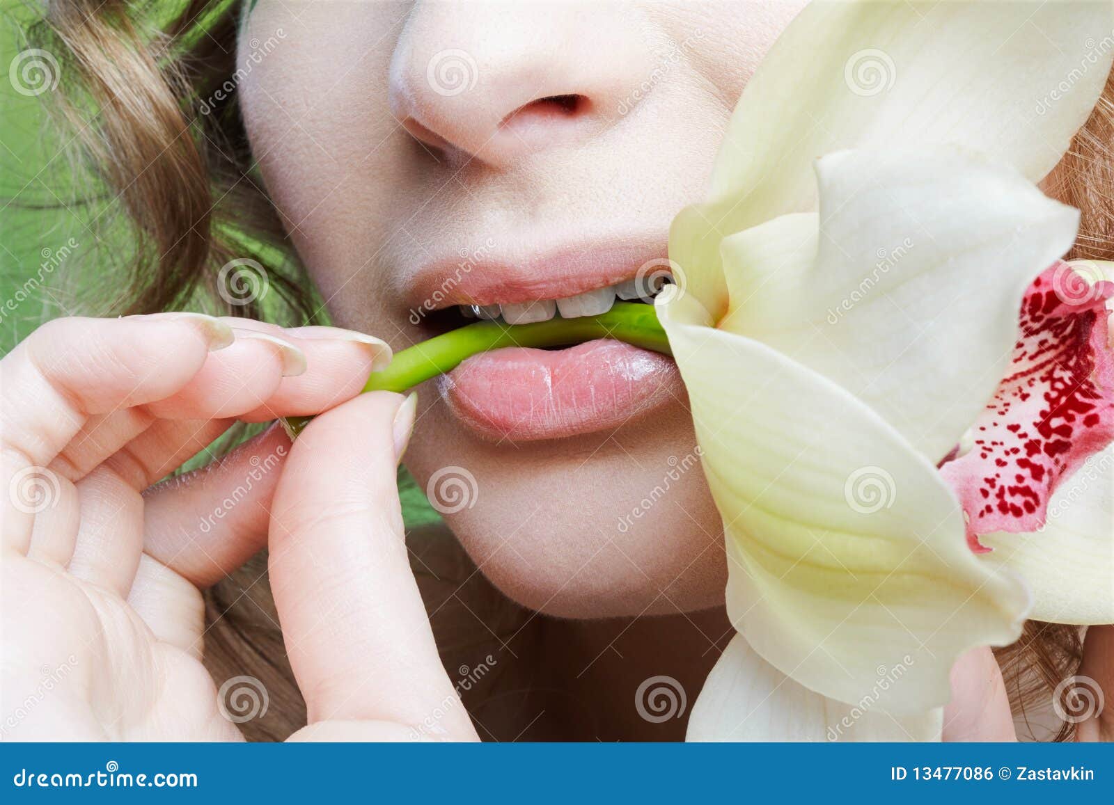 Girl biting lily flower stock photo. Image of caucasian - 13477086