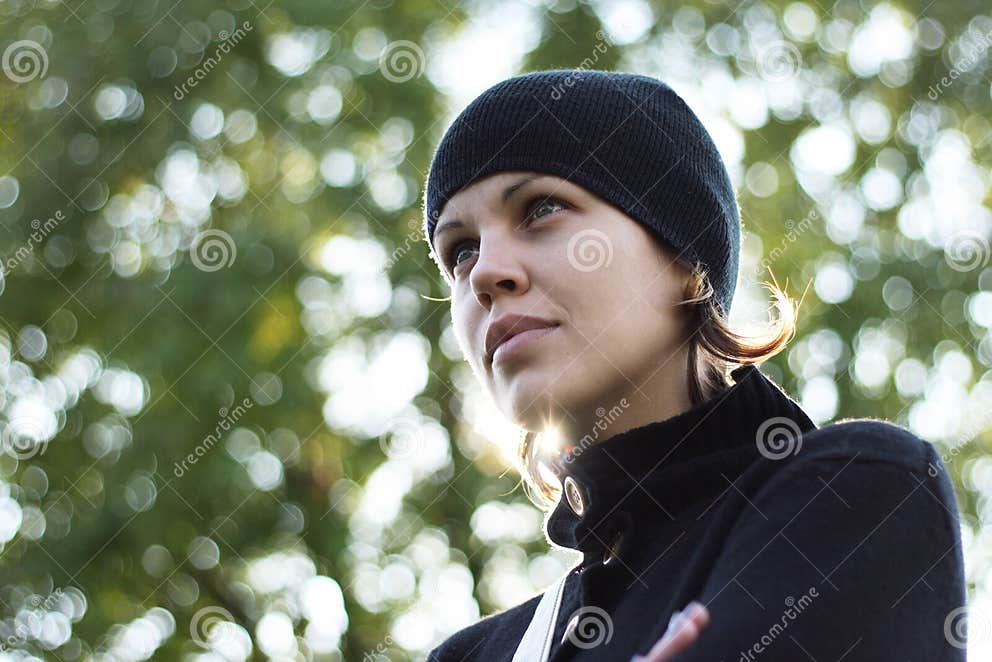 Girl in a black cap stock image. Image of illumination - 10599875