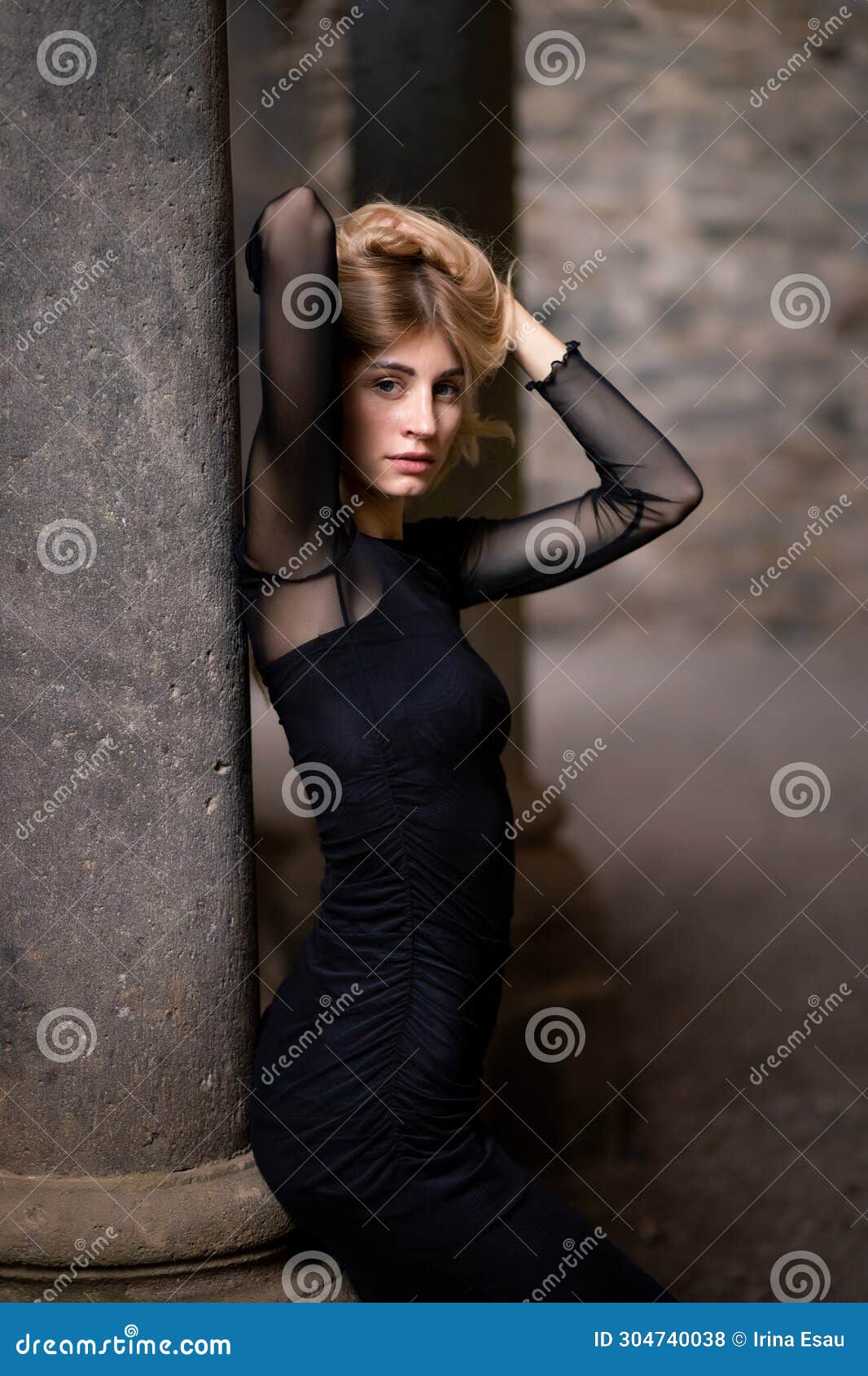 Girl in Black Dress Leaning on a Column Stock Photo - Image of ...