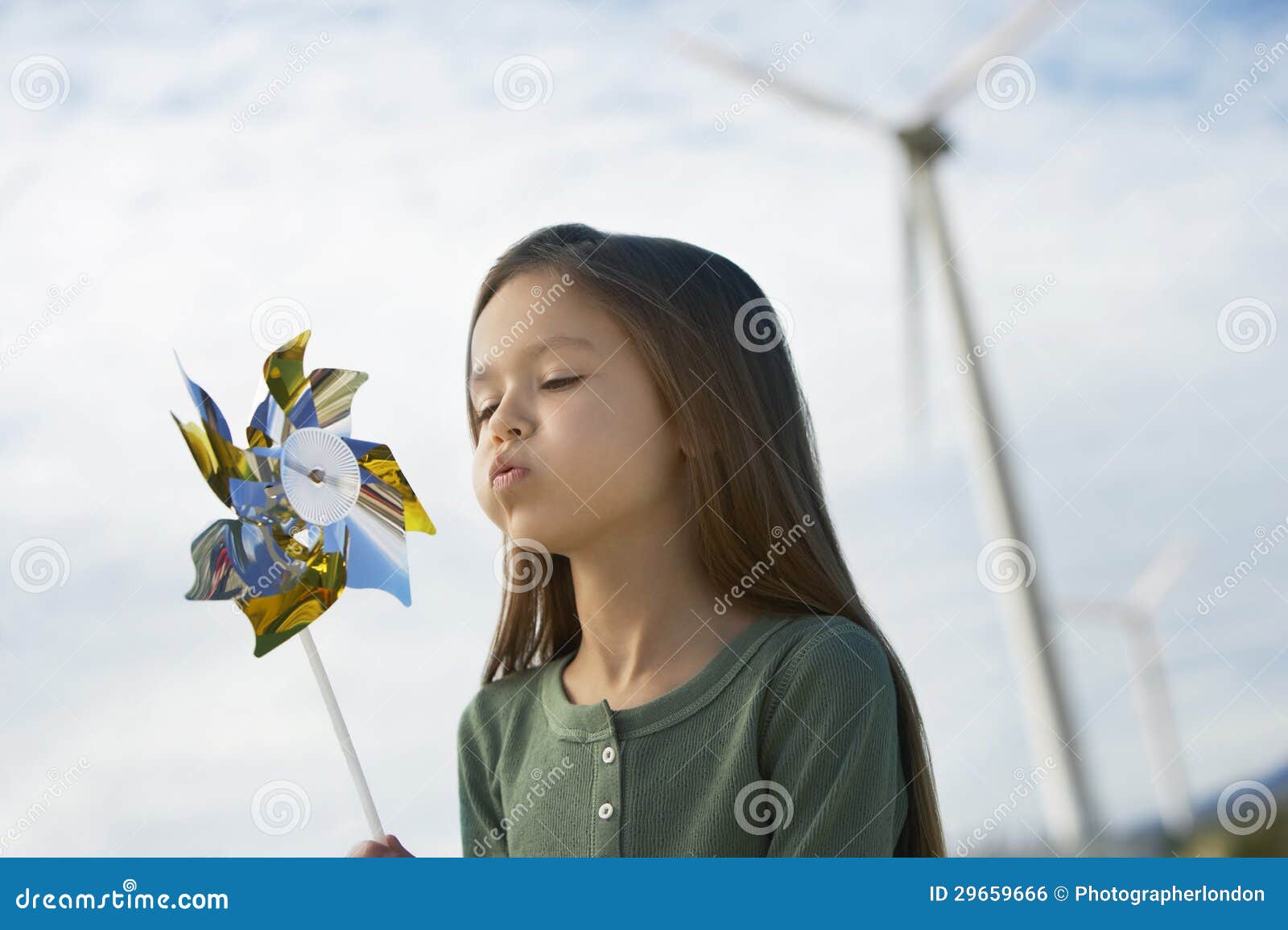 Girl Blowing Toy Windmill stock photo. Image of child - 29659666