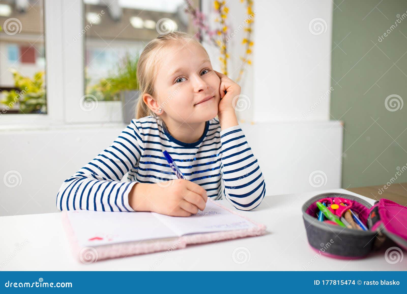 Girl with Blue Eyes Working on Homework Stock Photo - Image of ...