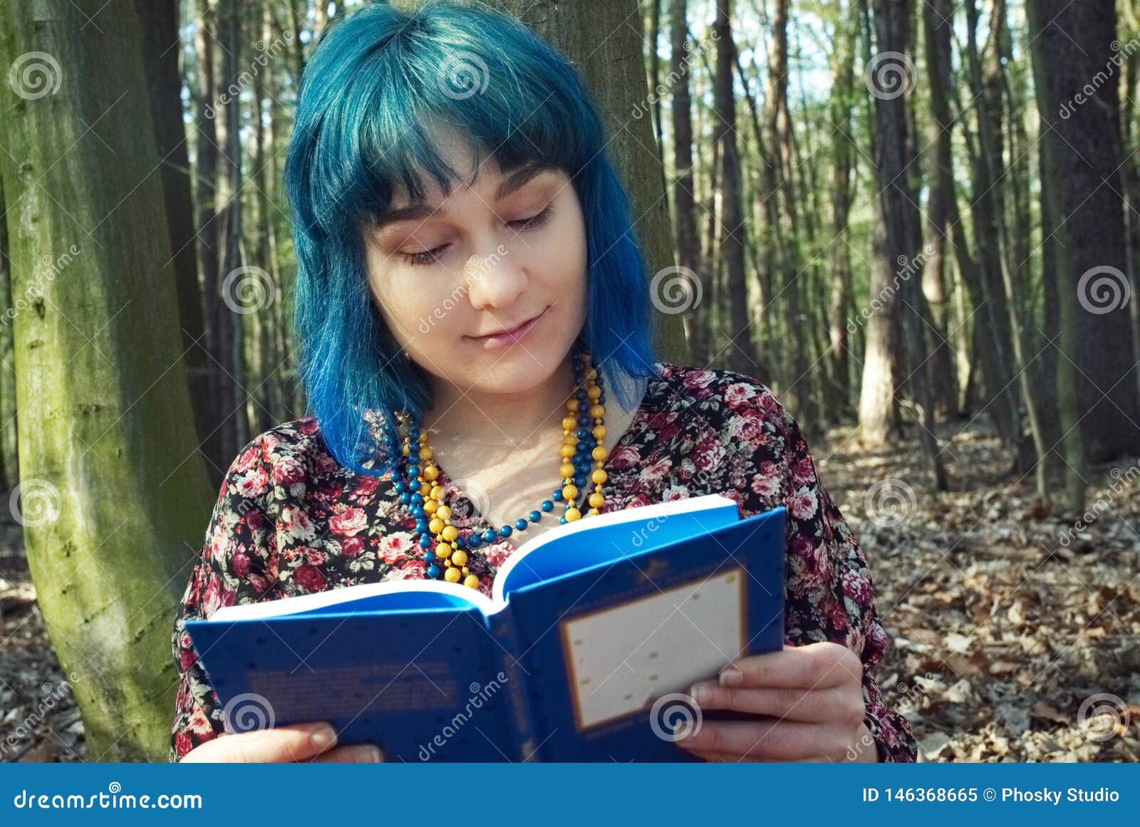 The Girl is Reading a Book in the Forest. Stock Image - Image of people ...