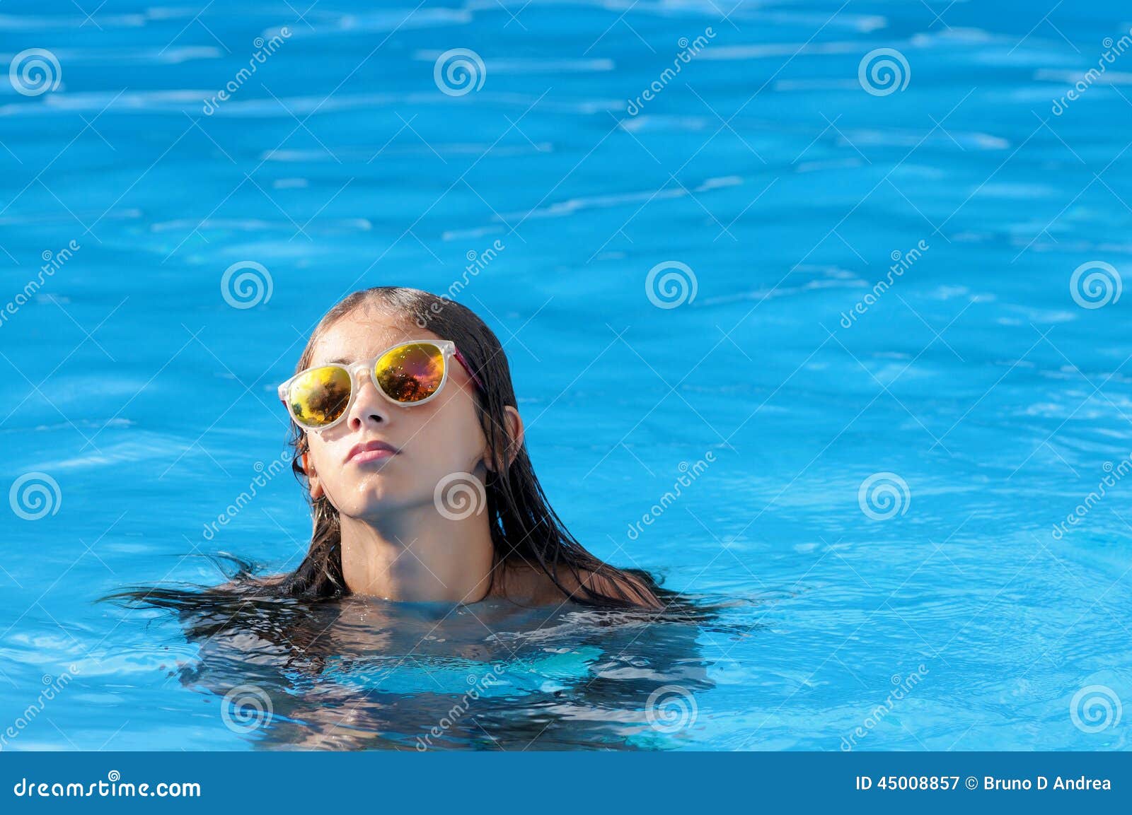 Girl in a Blue Swimming Pool Stock Image - Image of sunlight, female ...