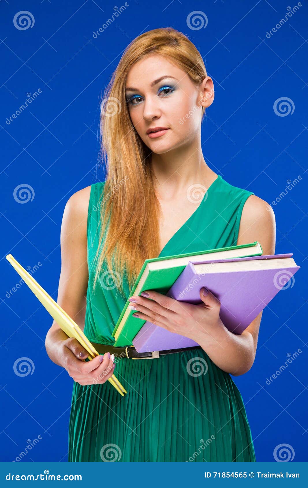 Girl with books in hand stock image. Image of looking - 71854565