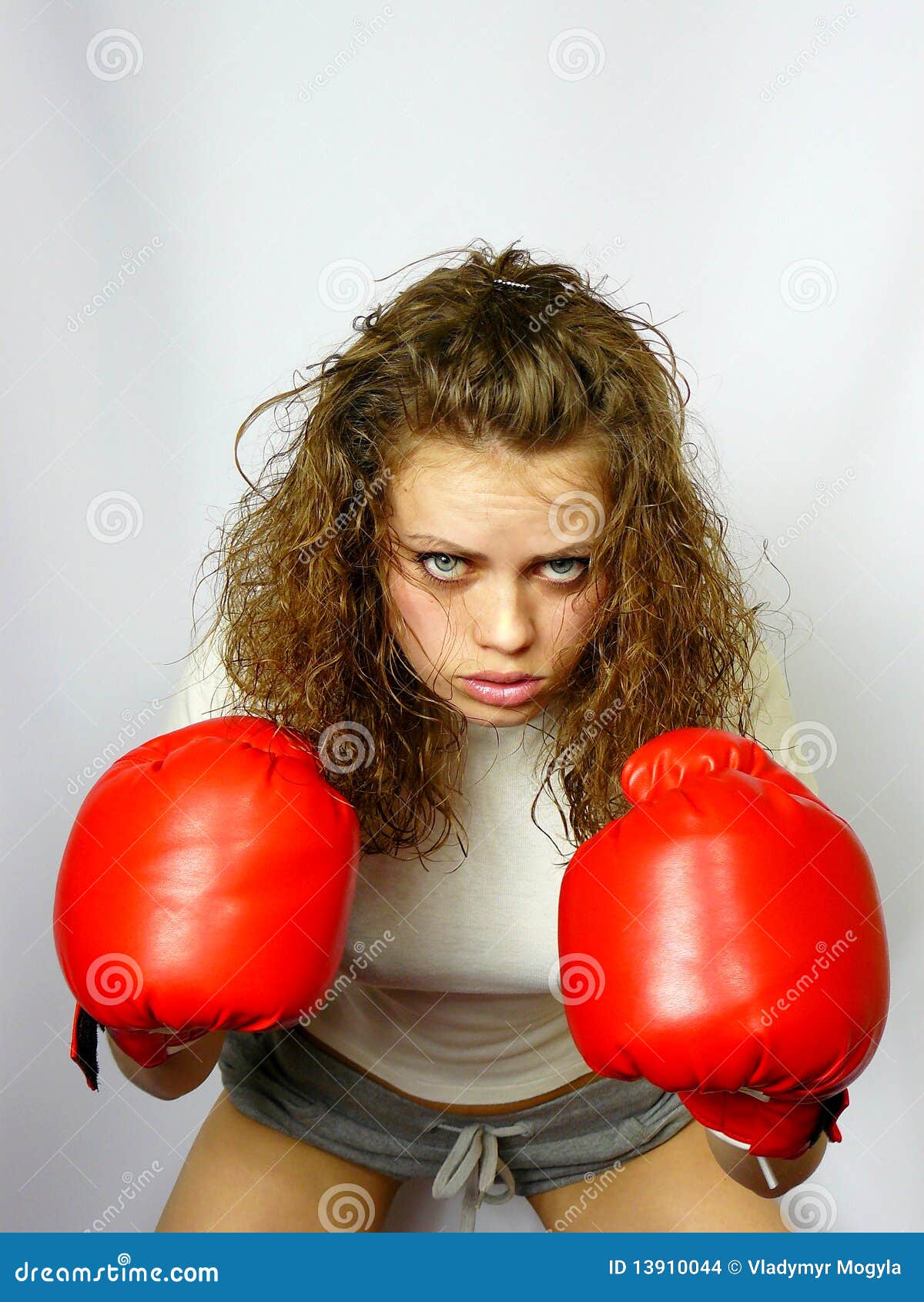 Girl boxing in red gloves stock photo. Image of expression - 13910044
