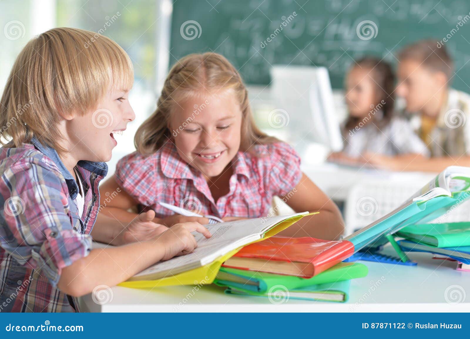 Girl and boy doing lessons stock photo. Image of preschool - 87871122