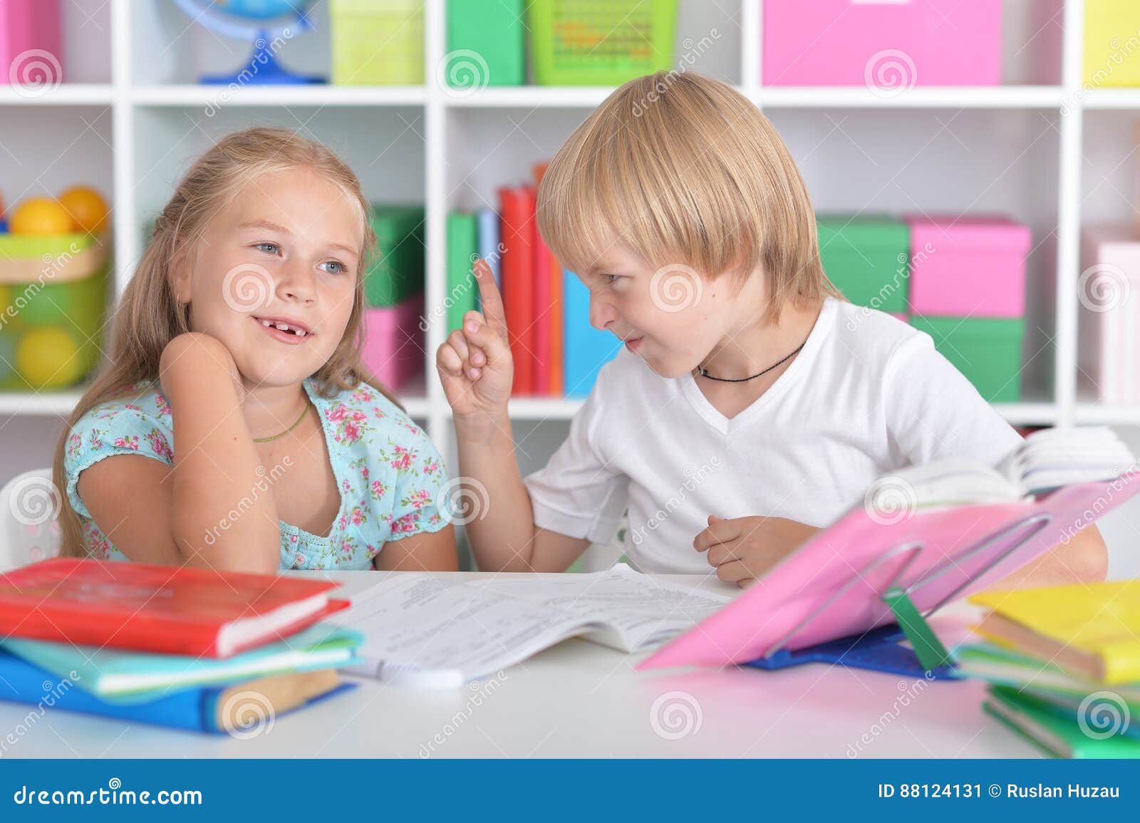 Girl and boy doing lessons stock image. Image of schoolgirl - 88124131
