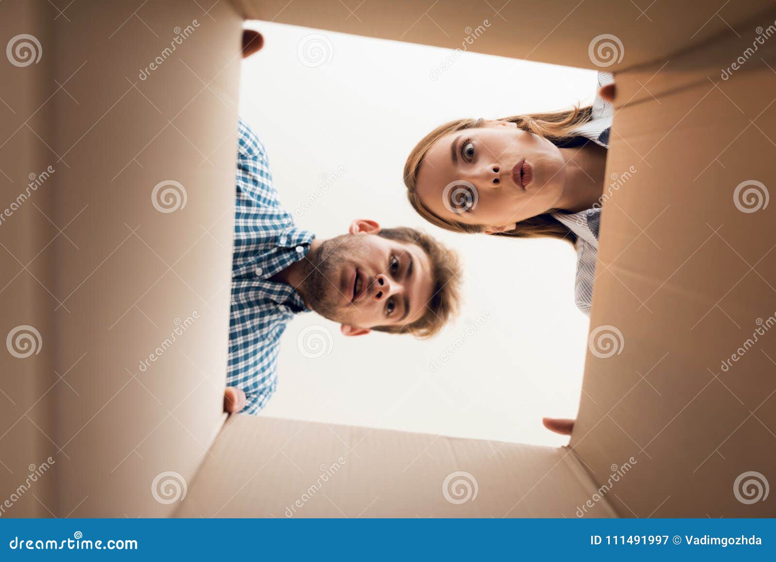 The Girl and the Boy are Looking at the Empty Box. View from Inside the ...