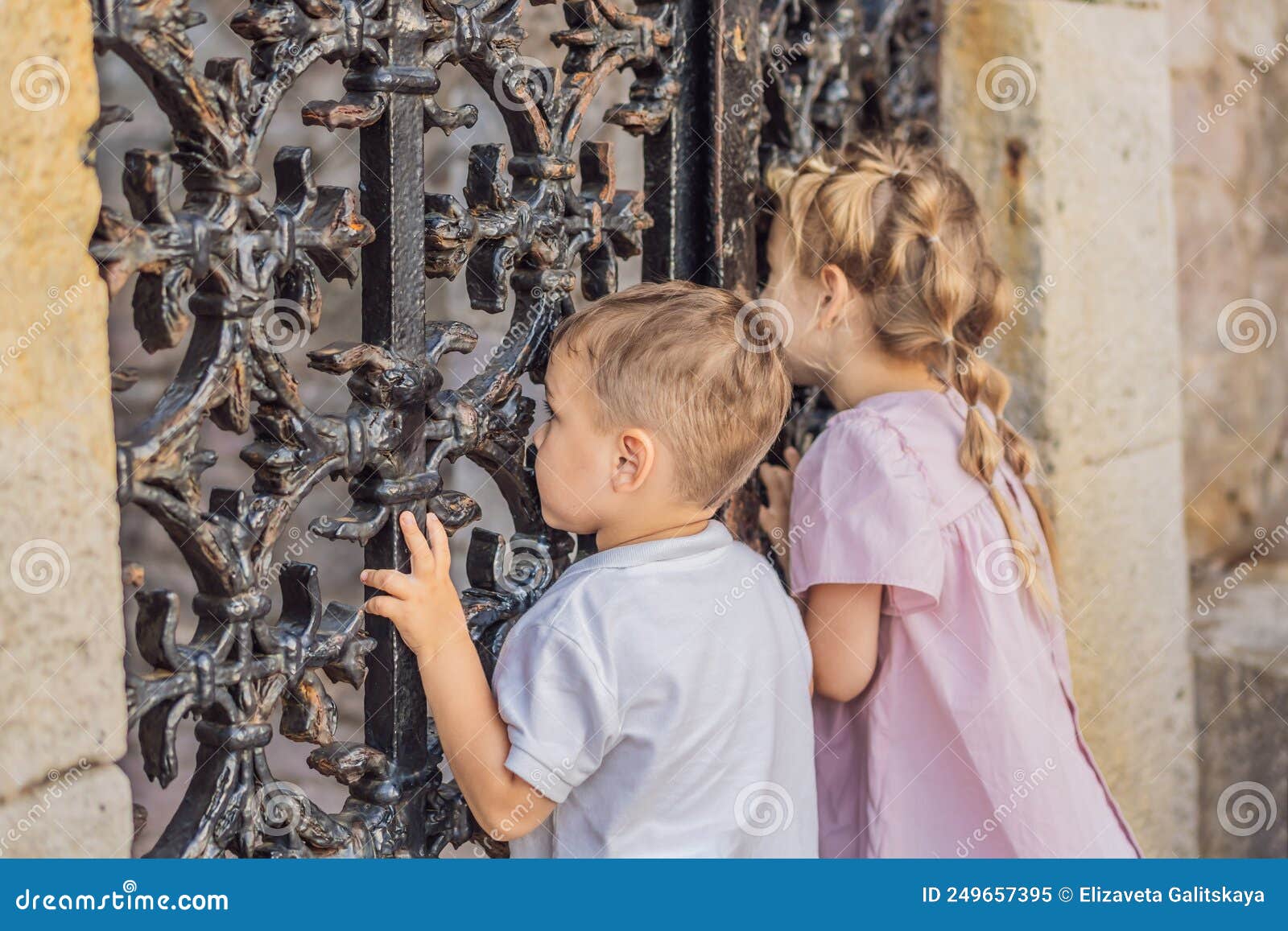Girl and Boy Peeking Over the Fence Stock Image - Image of game ...