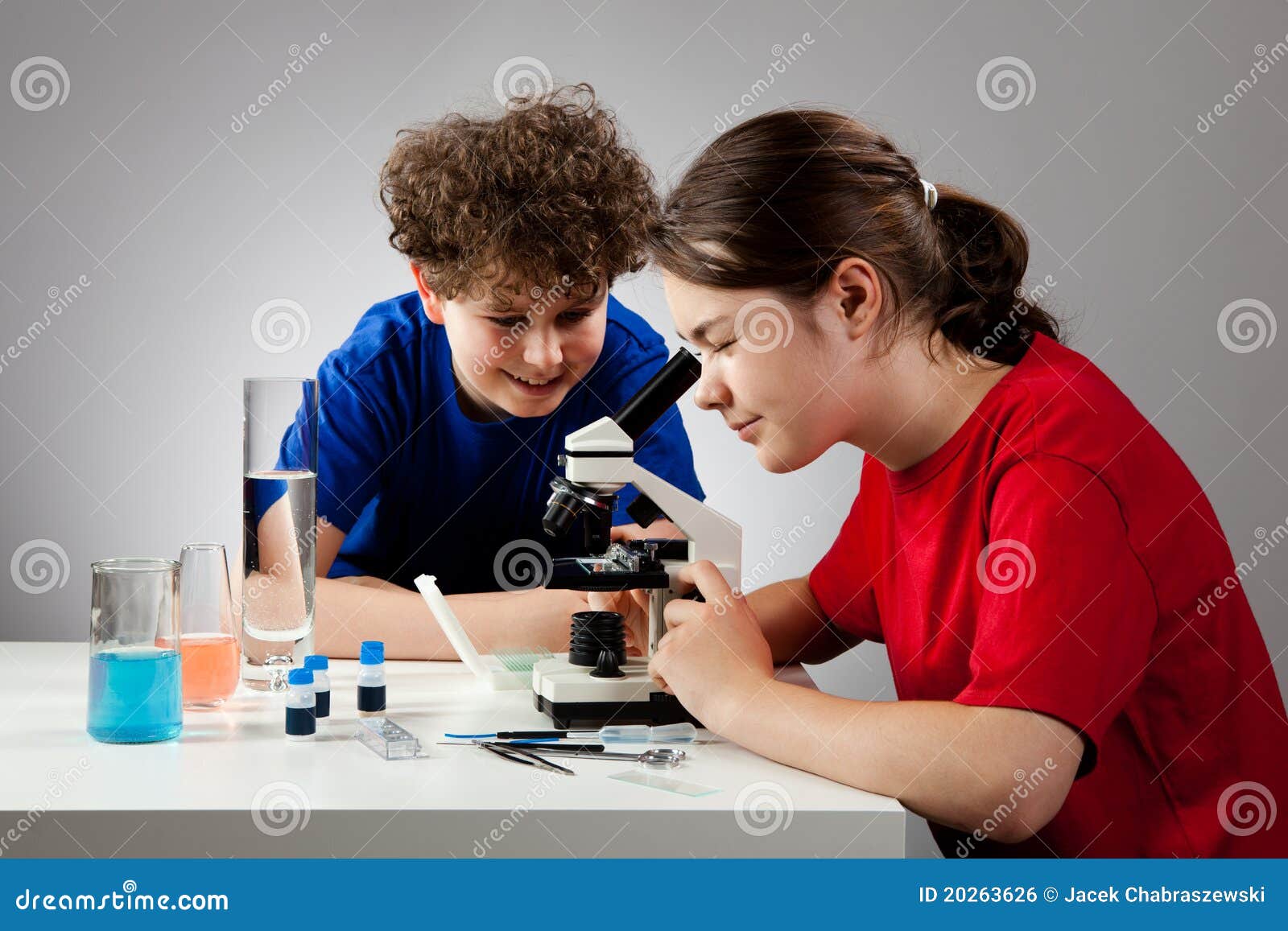 Girl and Boy Using Microscope Stock Photo - Image of educate, look ...