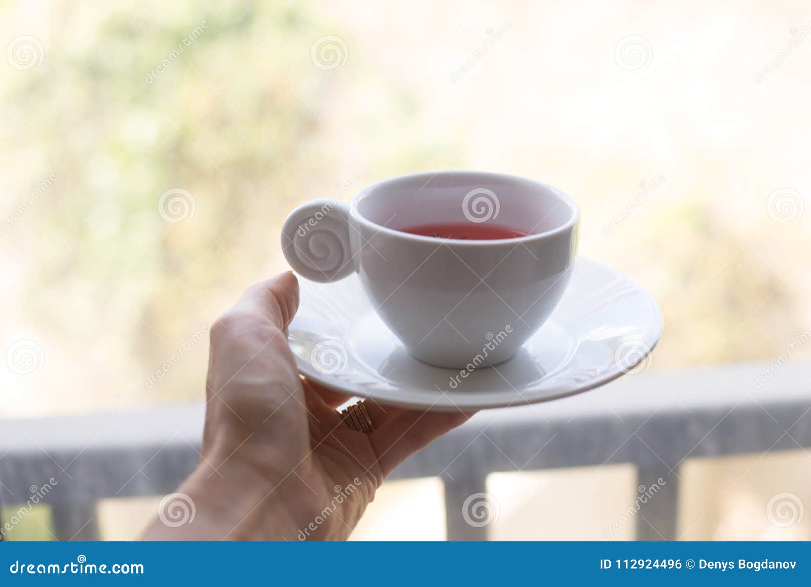A Girl is Bringing a Cup of Tea in the Morning Stock Photo - Image of ...