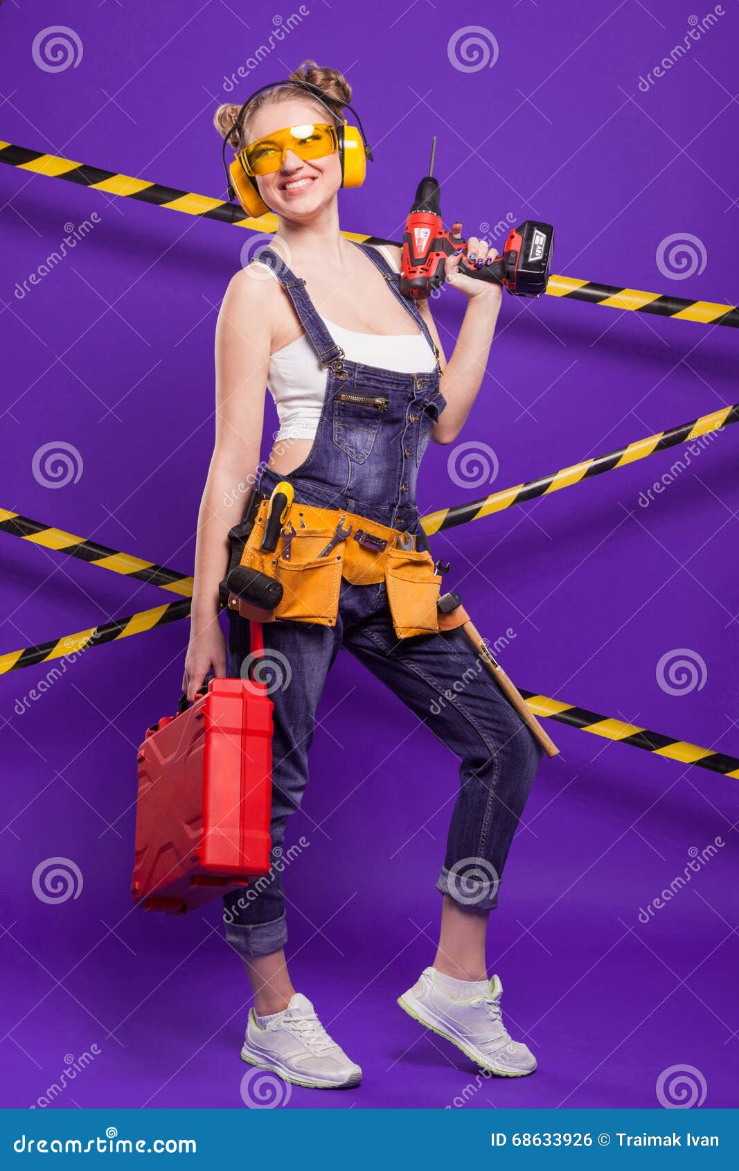 Girl Builder in the Construction Helmet and Goggles with a Construction ...