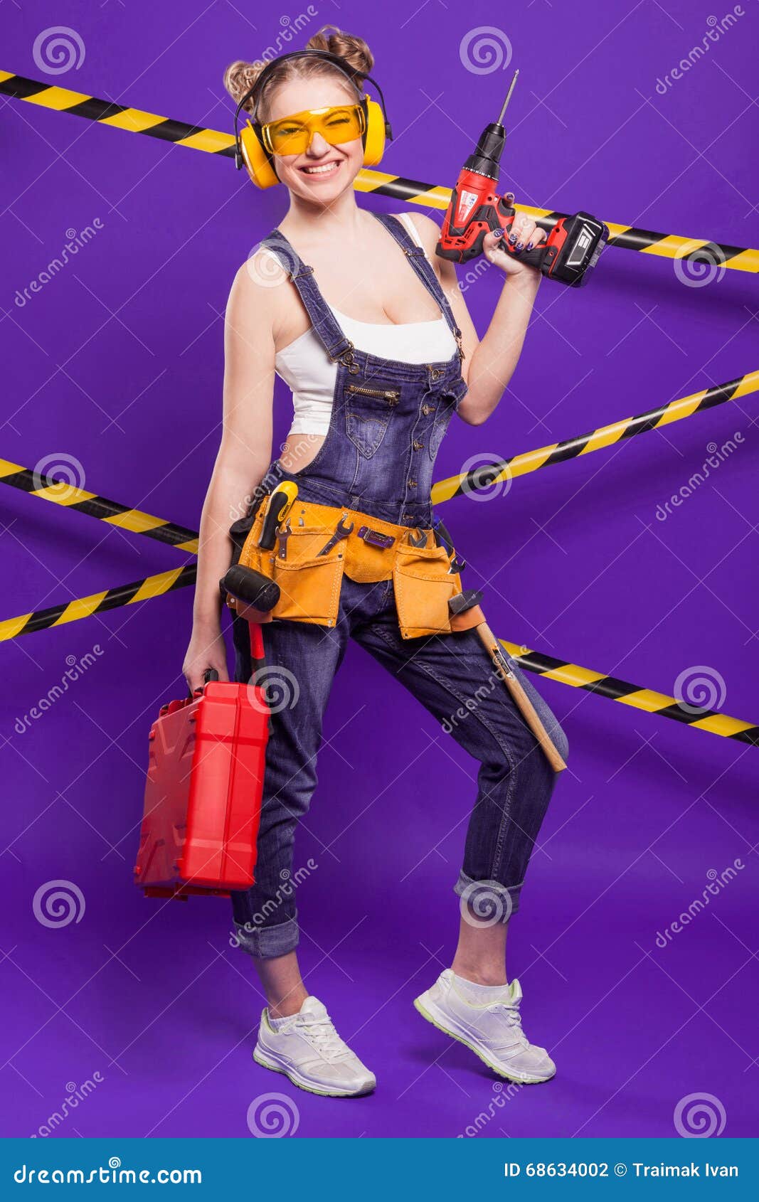 Girl Builder in the Construction Helmet and Goggles with a Construction ...