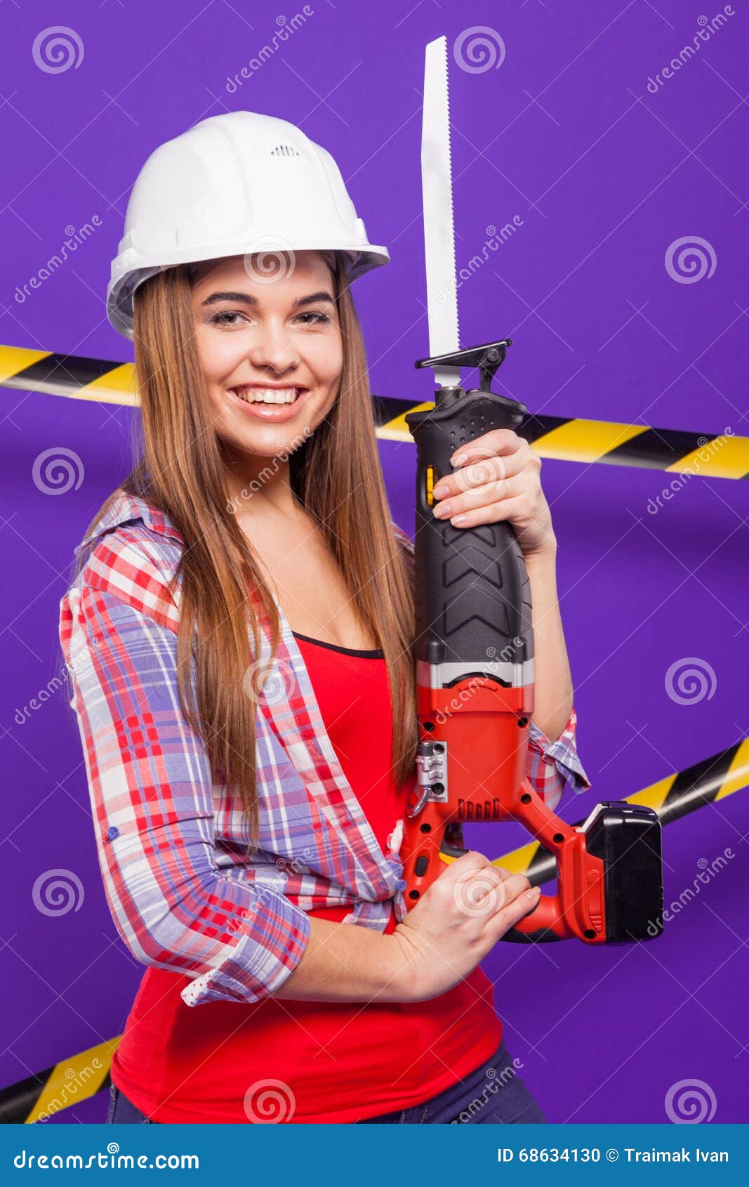 Girl Builder in the Construction Helmet and Goggles with a Construction ...