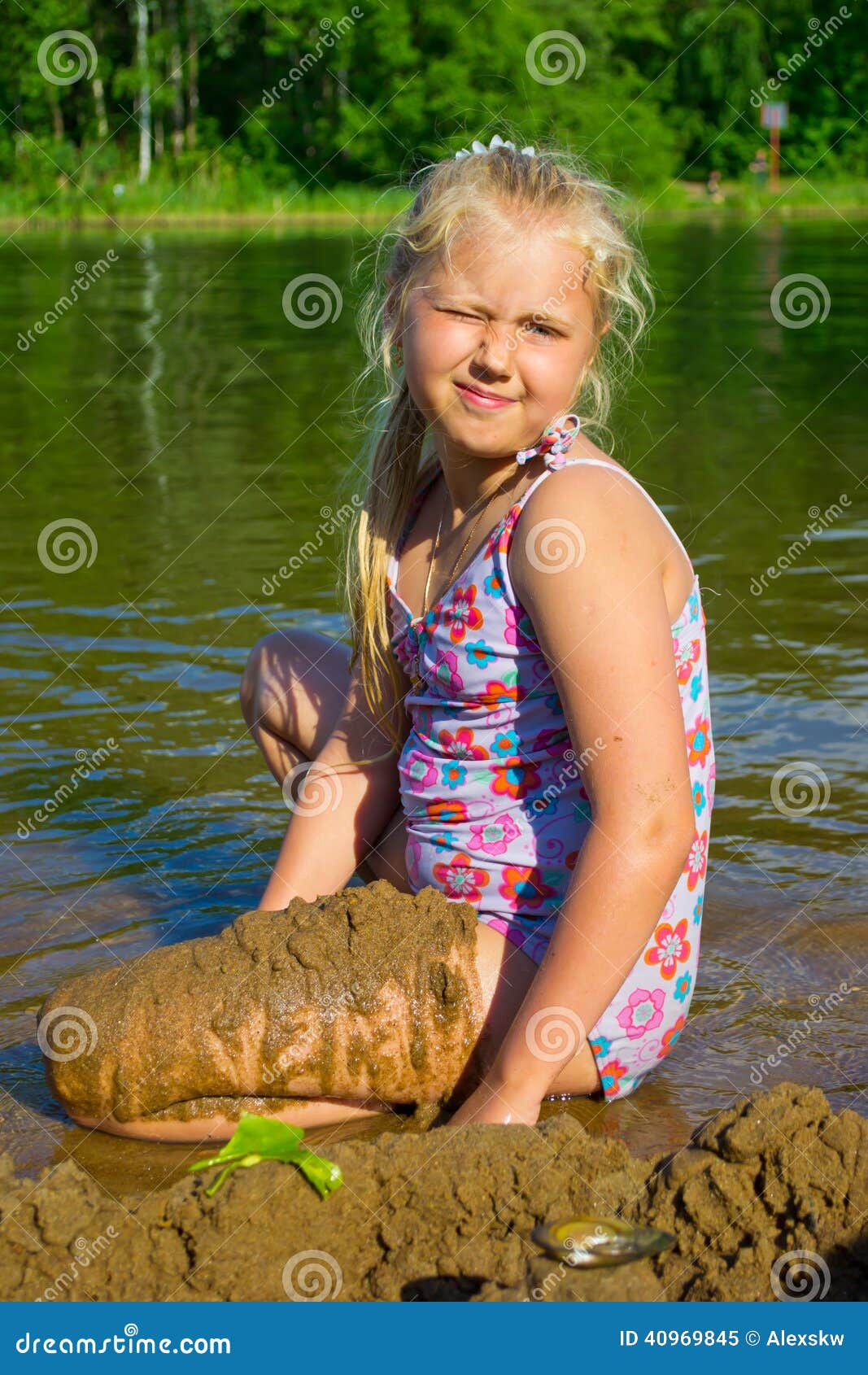 Girl builds a sand castle stock image. Image of body - 40969845 Girl builds a sand castle stock image. Image of body - 40969845