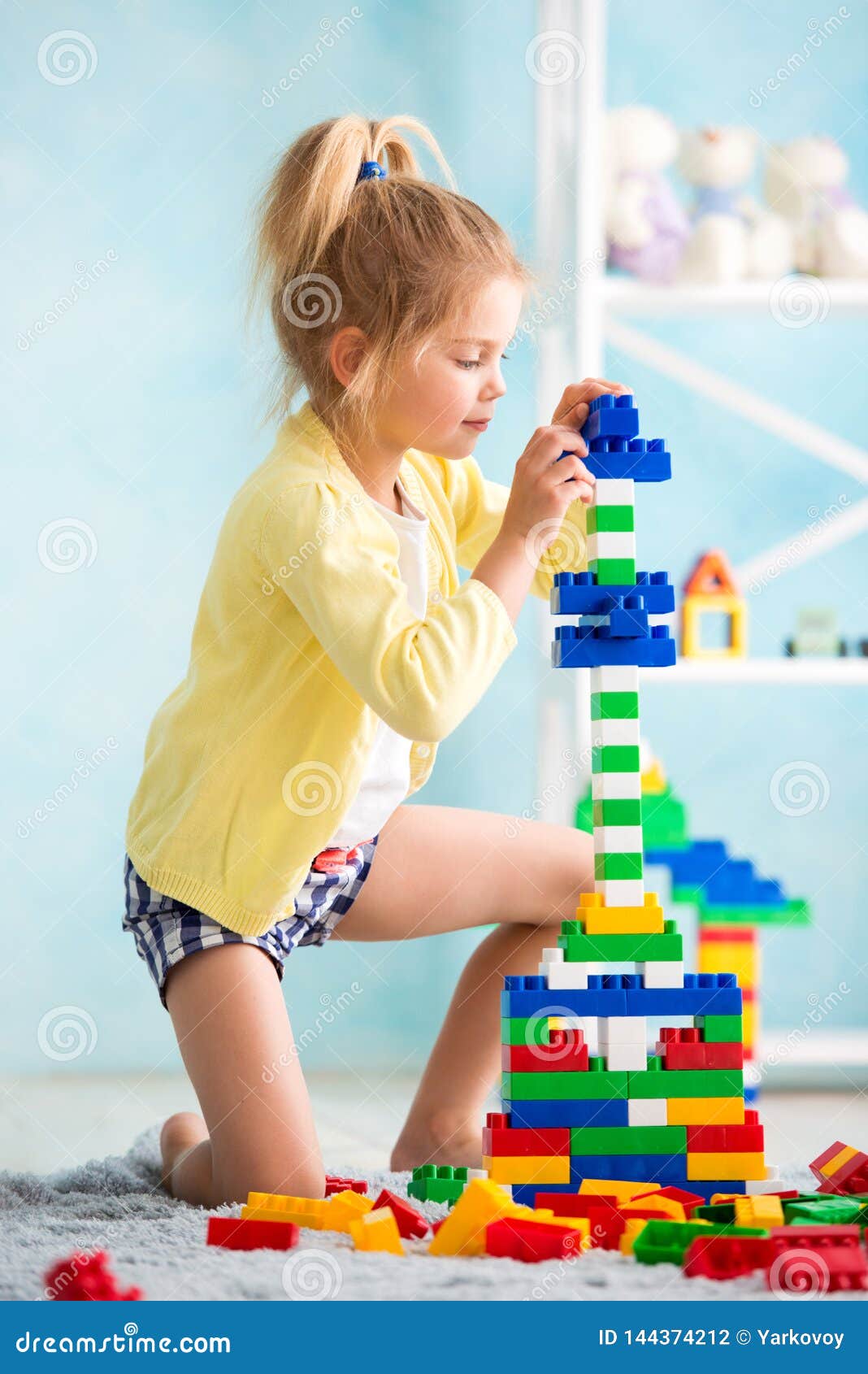 The Girl Built a Tower of Cubes. the Joy of Games Stock Photo - Image ...