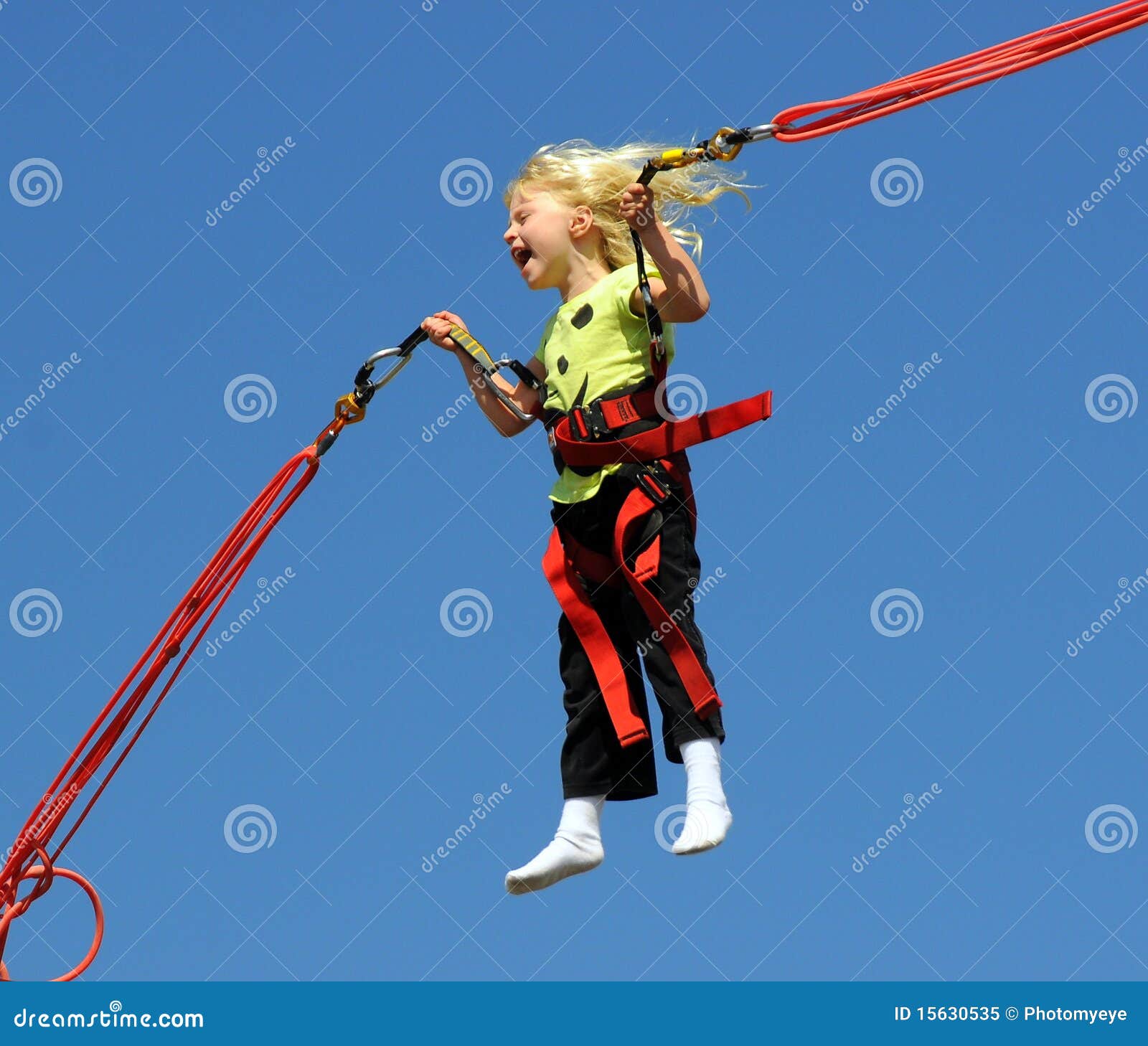 Girl on bungee trampoline stock image. Image of girl - 15630535