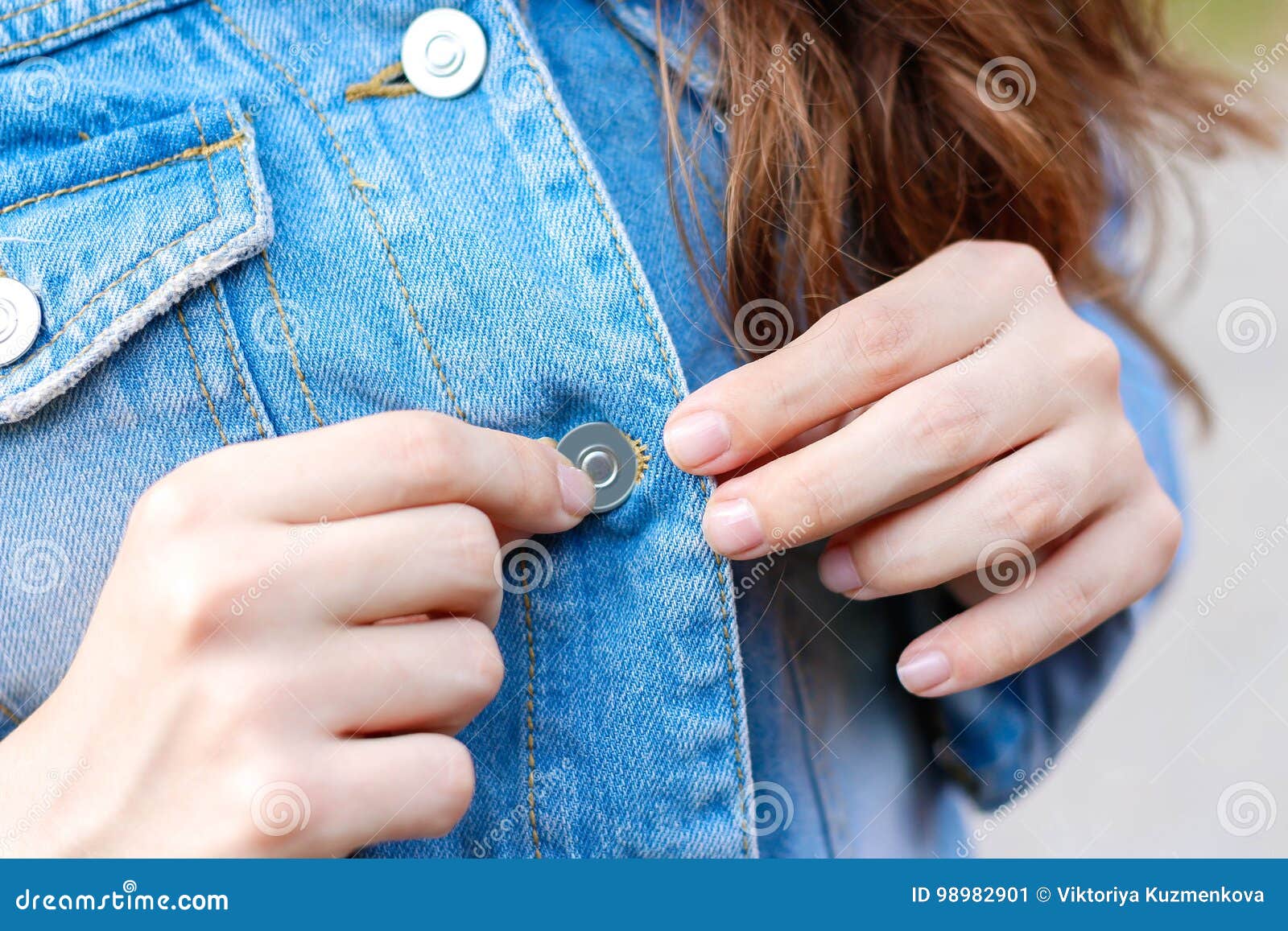 Girl Buttoning a Blue Denim Shirt. Closeup Stock Image - Image of ...