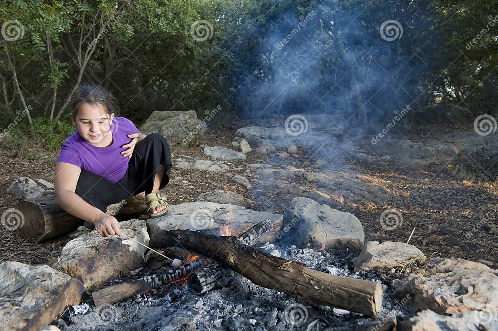 Girl and campfire stock image. Image of fire, nature - 15413605