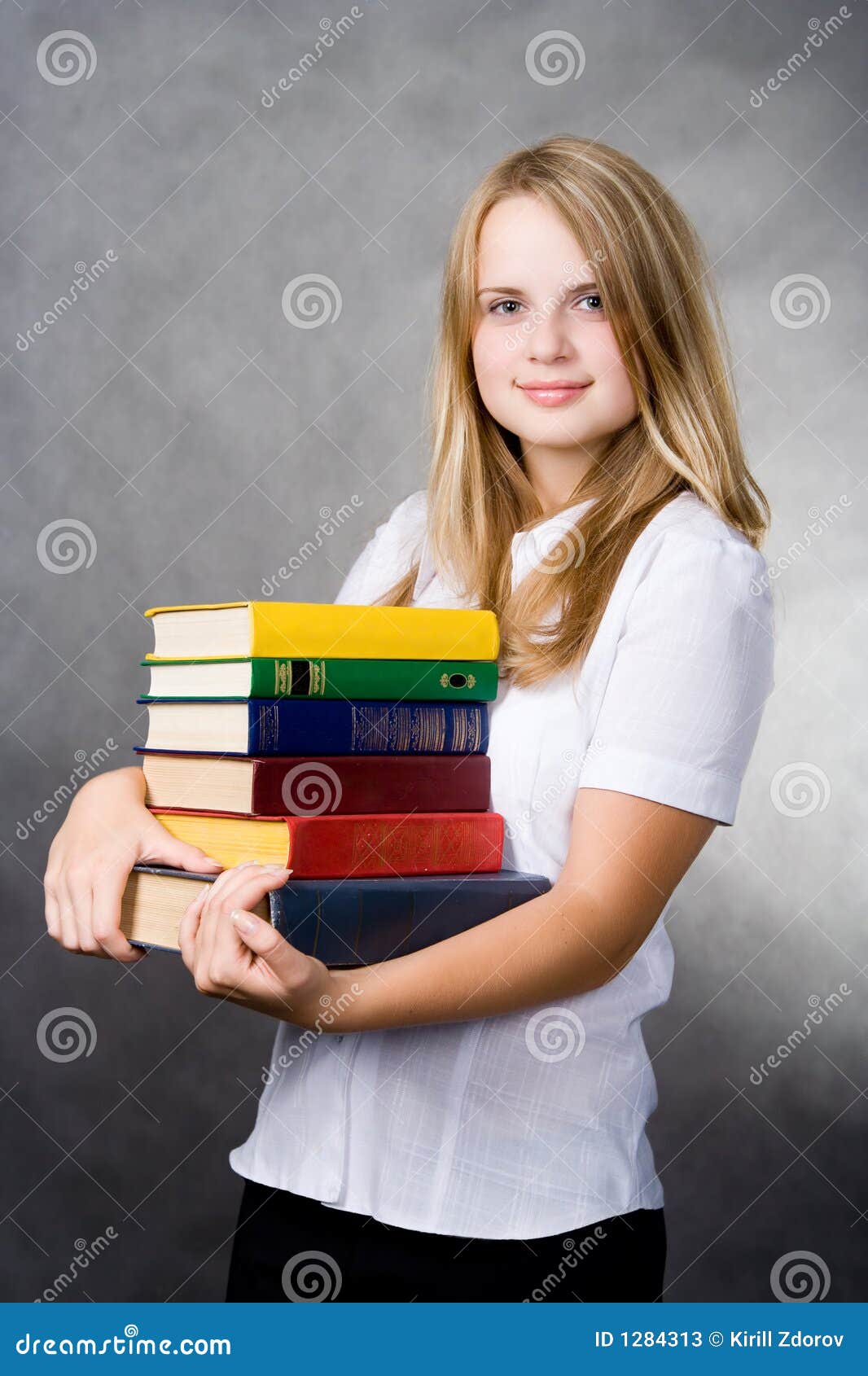Girl carrying books stock image. Image of learning, happy - 1284313