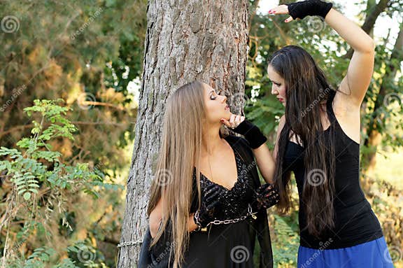 Girl chained to a tree stock image. Image of blonde, outdoor - 22057649