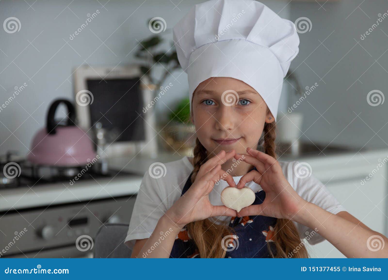 Girl in the Chef Hat Showing Heart Macaroon Stock Image - Image of ...